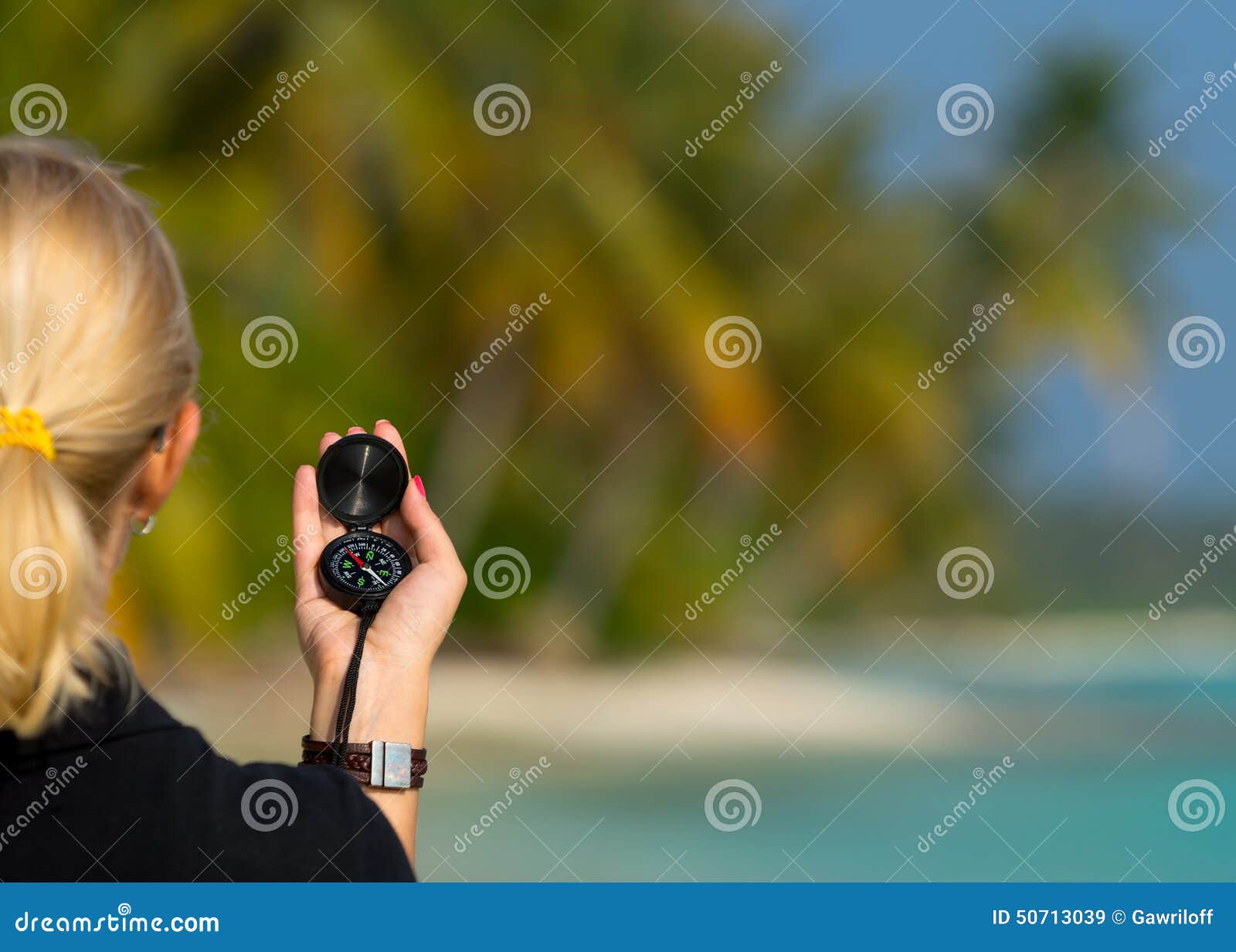 Compass on Woman Hand Against Beach Landscape Stock Image - Image of ...