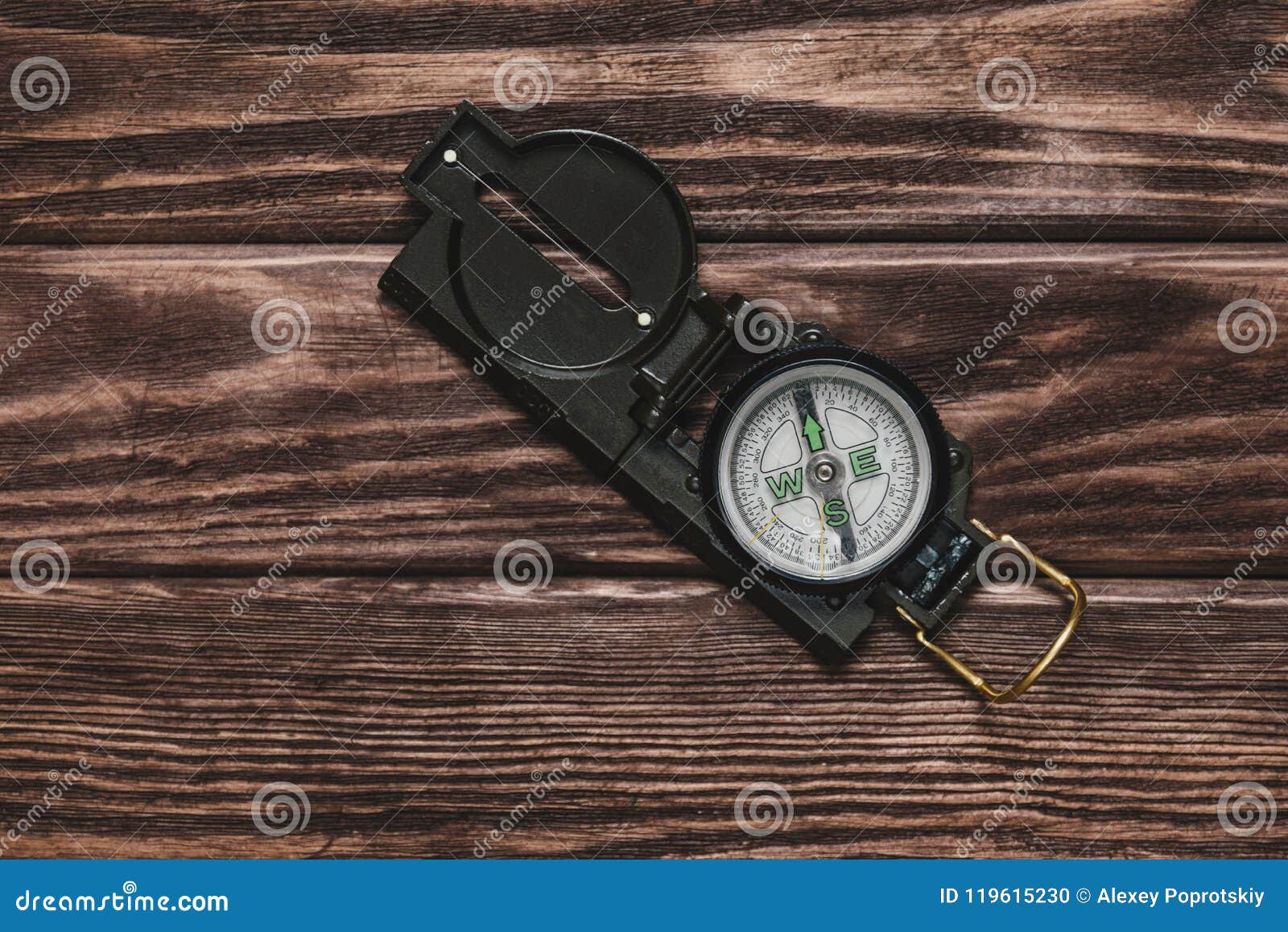 Compass on wooden table. stock photo. Image of arrow - 119615230