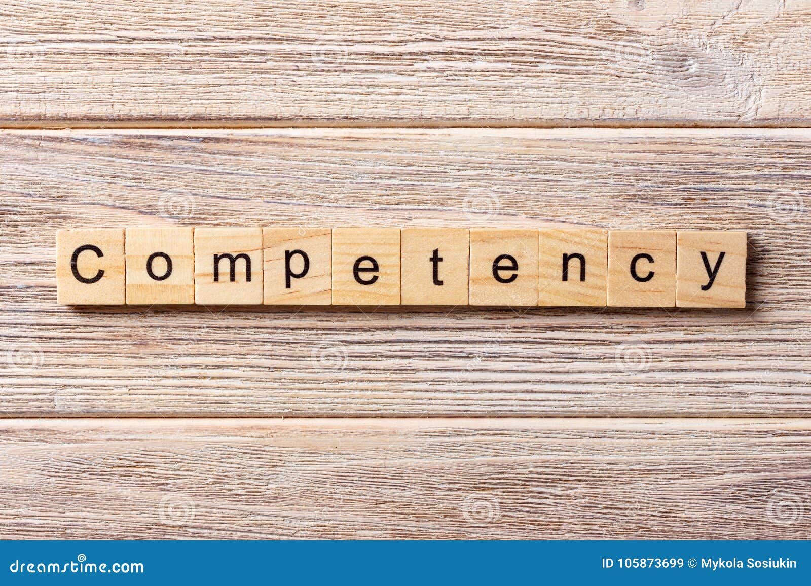 Competency Word Written on Wood Block. Competency Text on Table ...