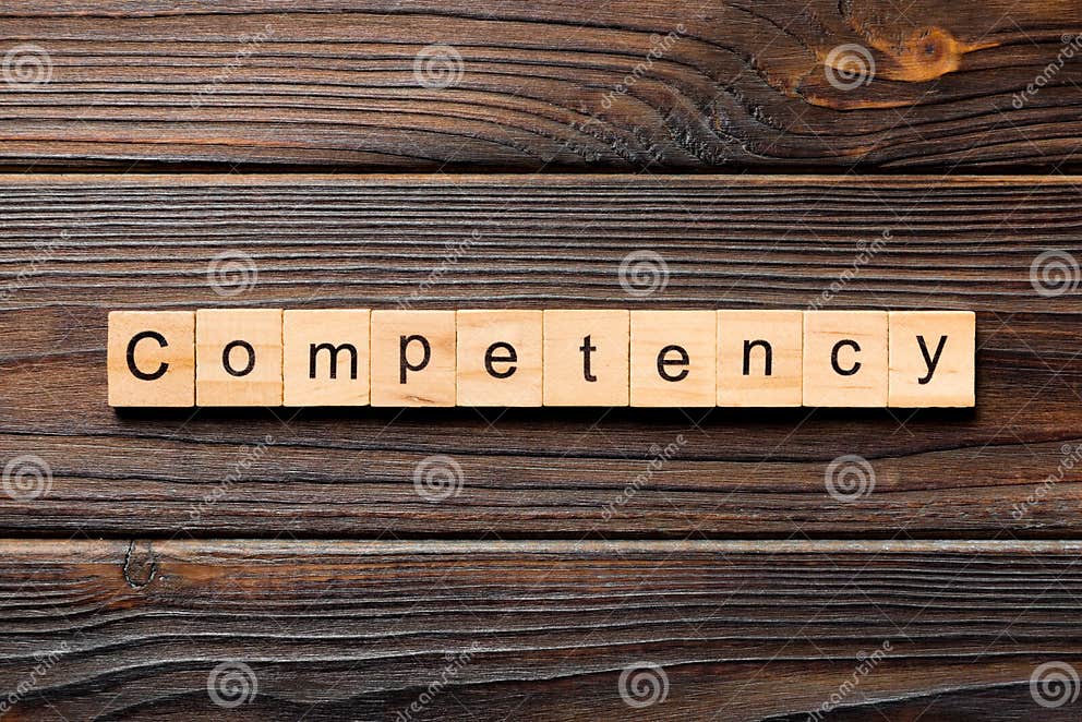 Competency Word Written on Wood Block. Competency Text on Table ...