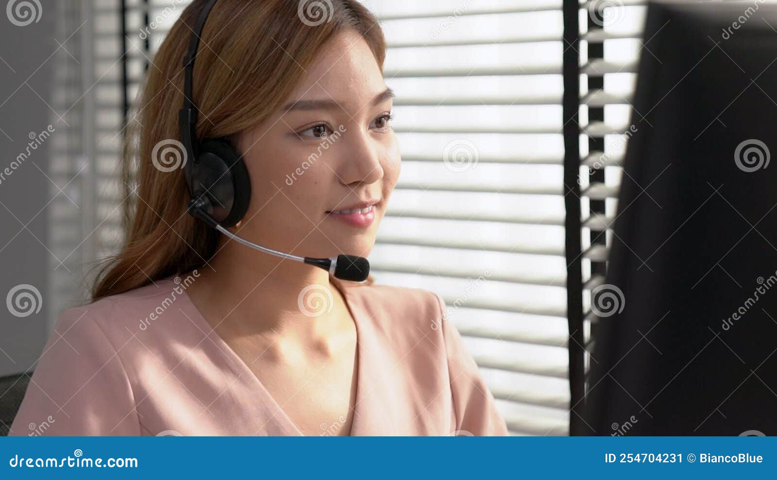 Competent Female Operator Working on Computer and while Talking with ...