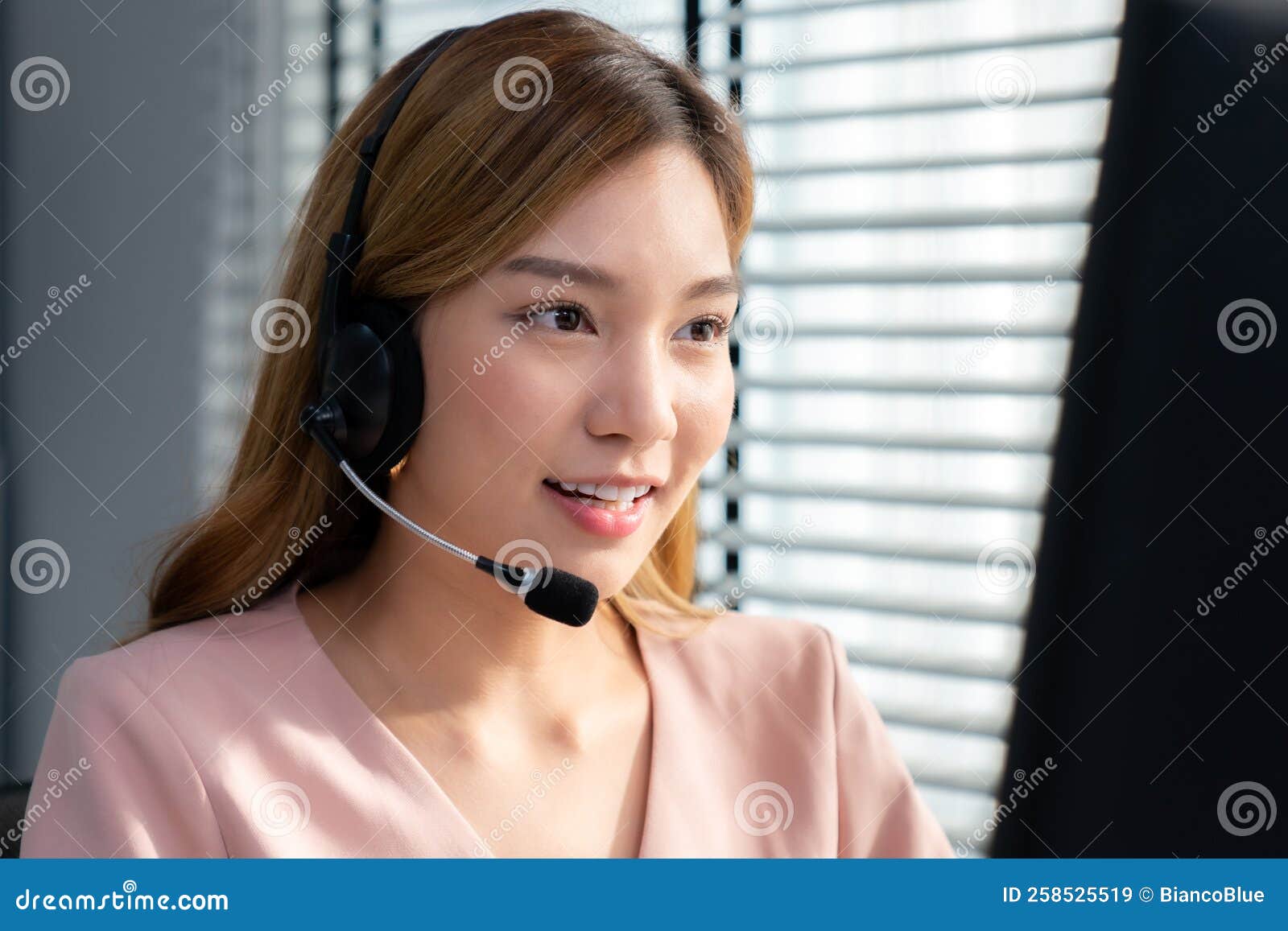 Competent Female Operator Working on Computer and while Talking with ...