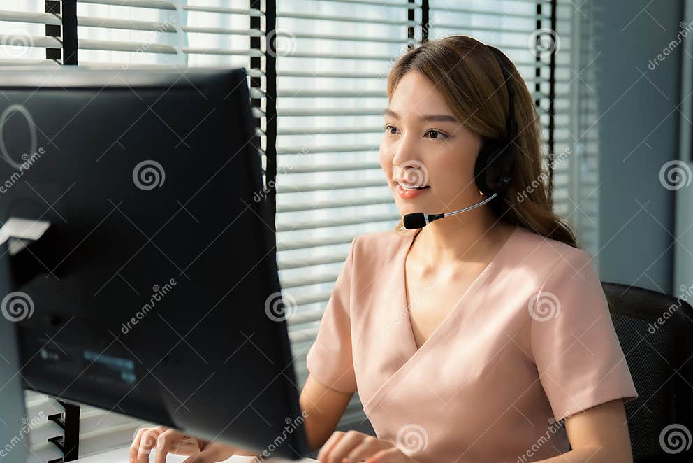 Competent Female Operator Working on Computer and while Talking with ...