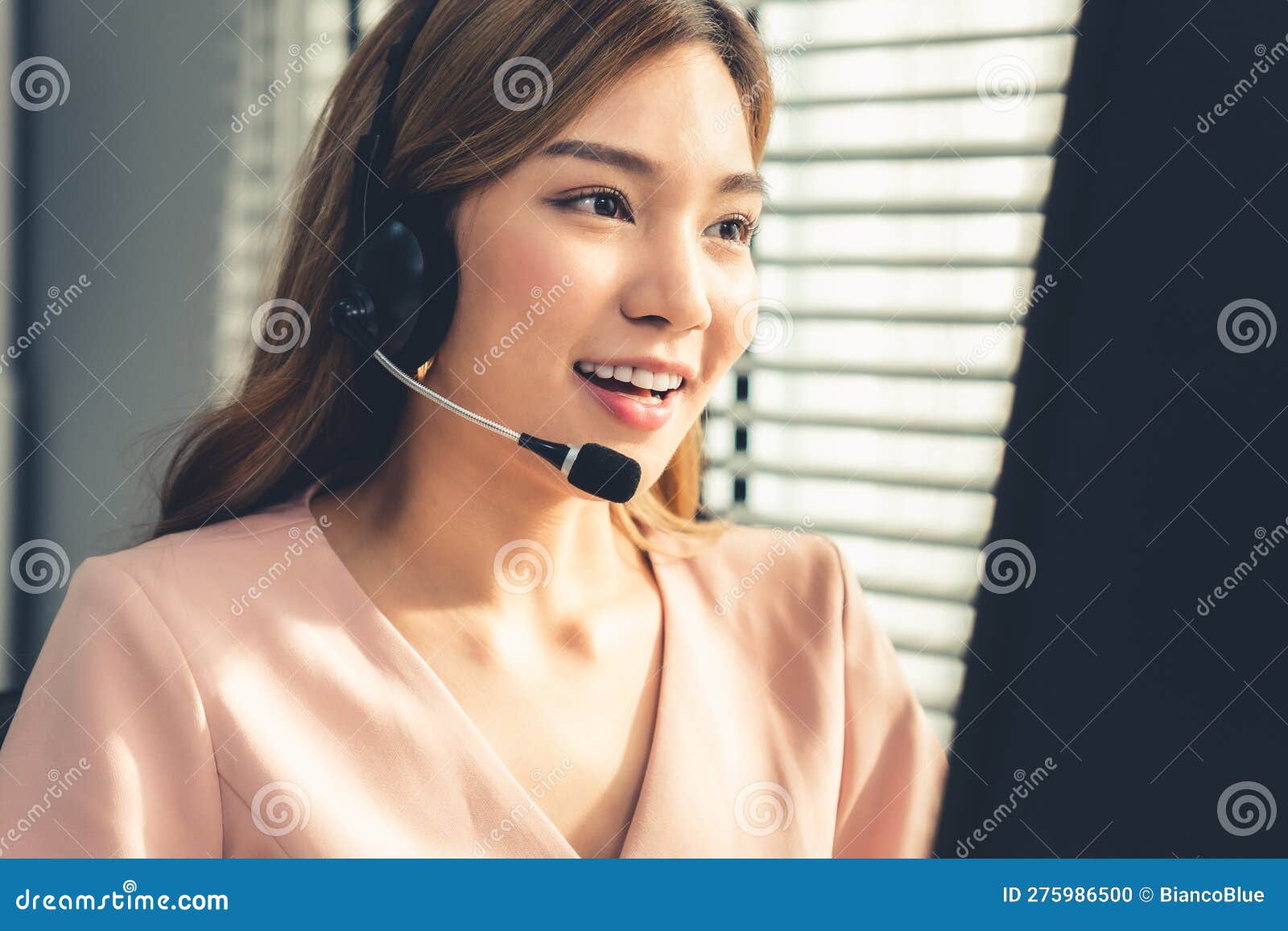 Competent Female Operator Working on Computer and while Talking with ...