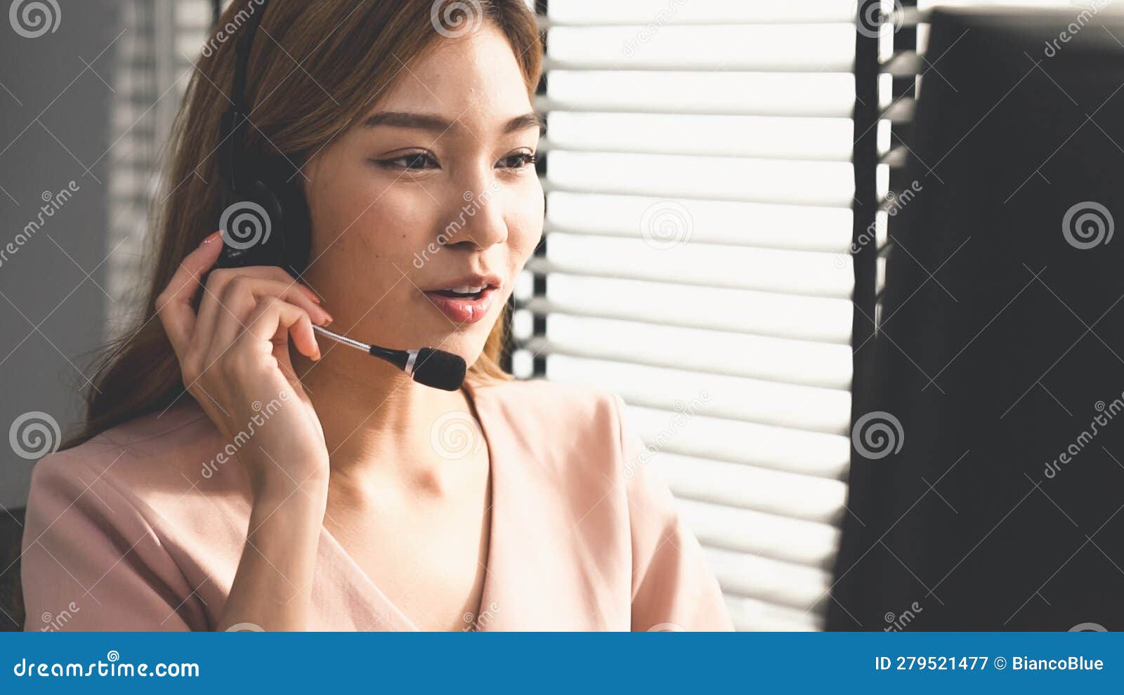 Competent Female Operator Working on Computer and while Talking with ...