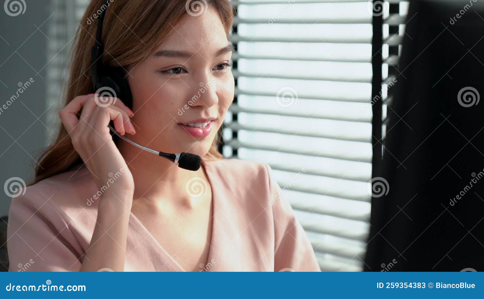 Competent Female Operator Working on Computer and while Talking with ...