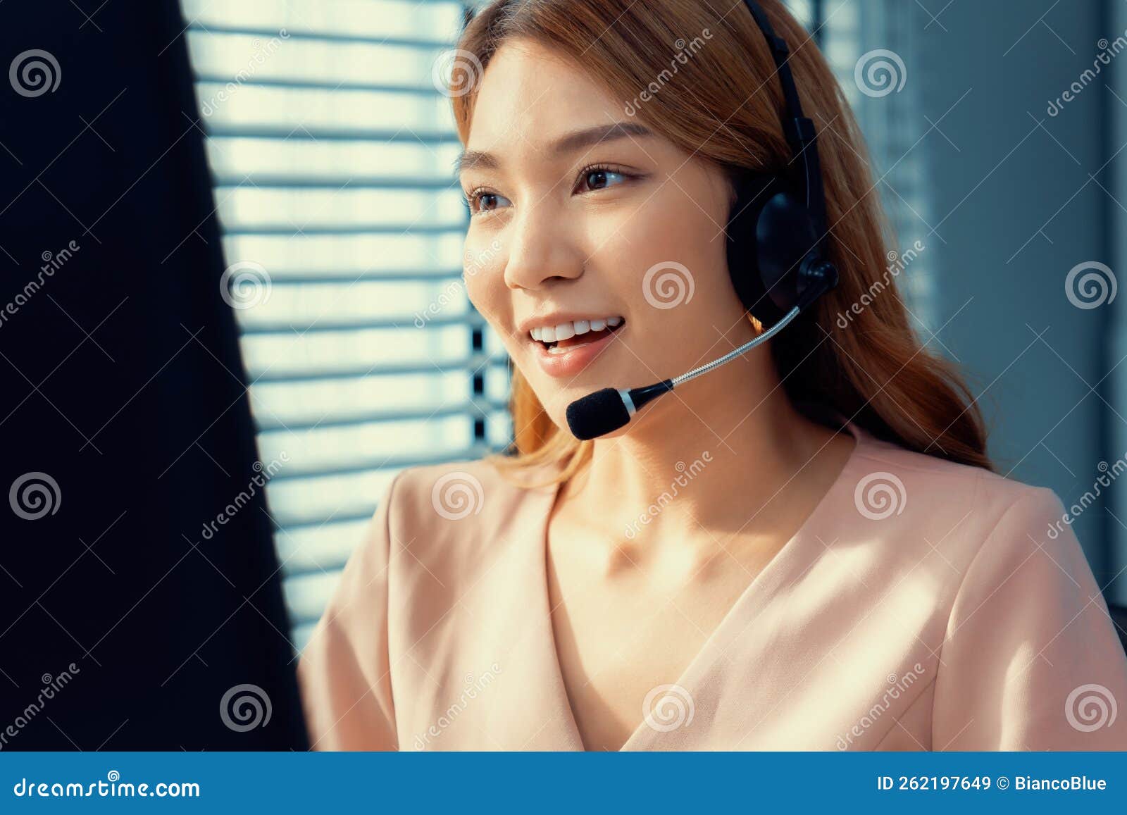 Competent Female Operator Working on Computer and while Talking with ...