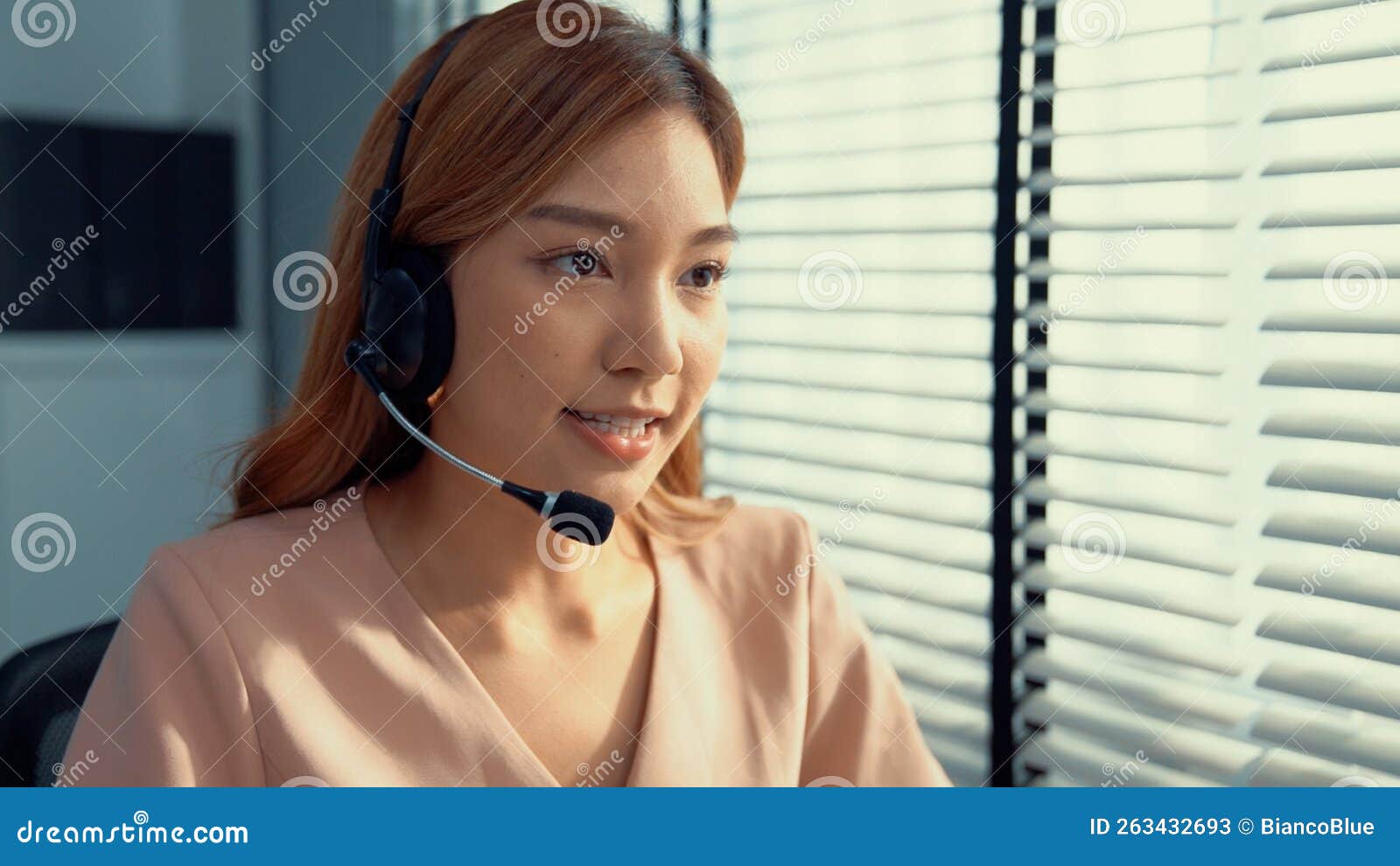 Competent Female Operator Working on Computer and while Talking with ...