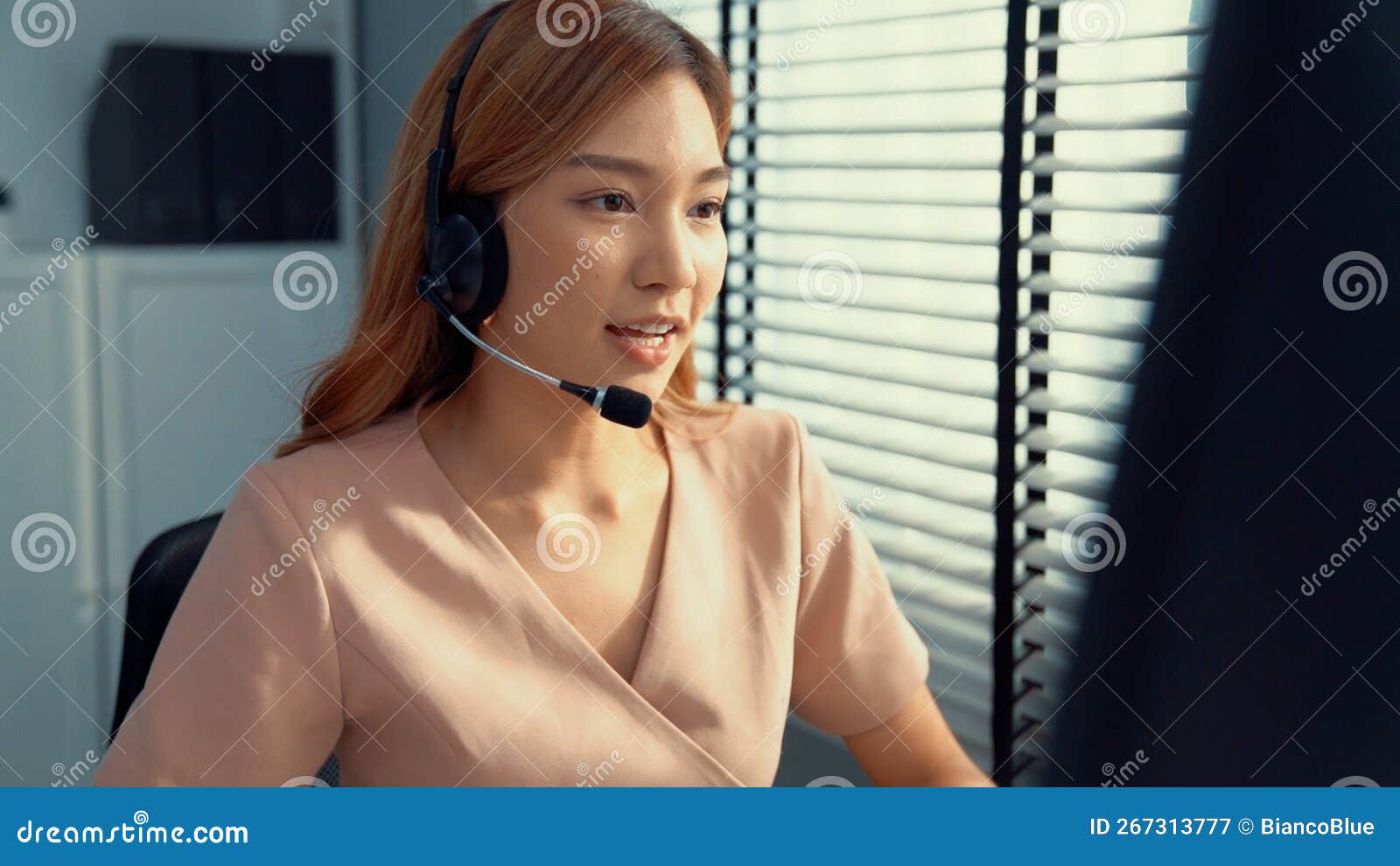 Competent Female Operator Working on Computer and while Talking with ...