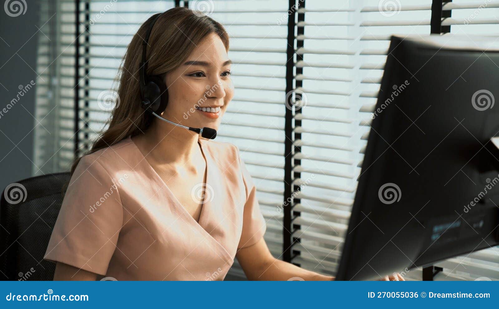 Competent Female Operator Working on Computer and while Talking with ...