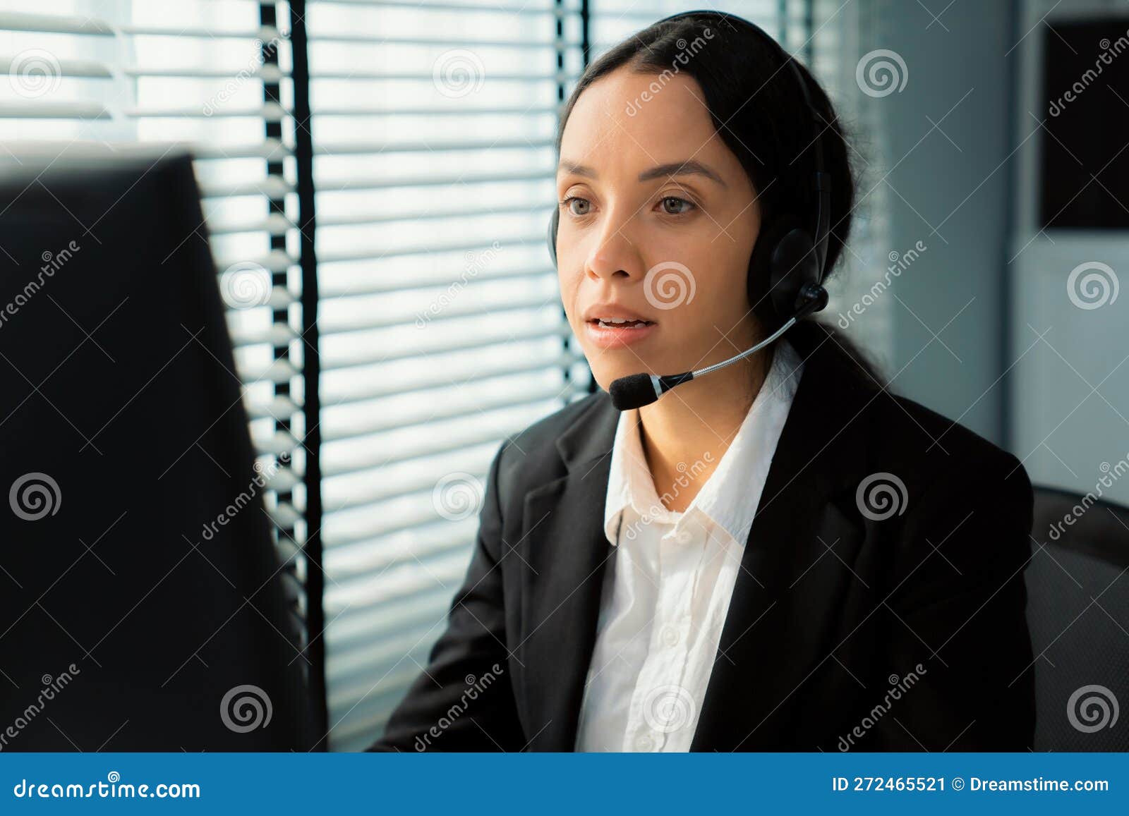 Competent Female Operator Working on Computer and while Talking with ...