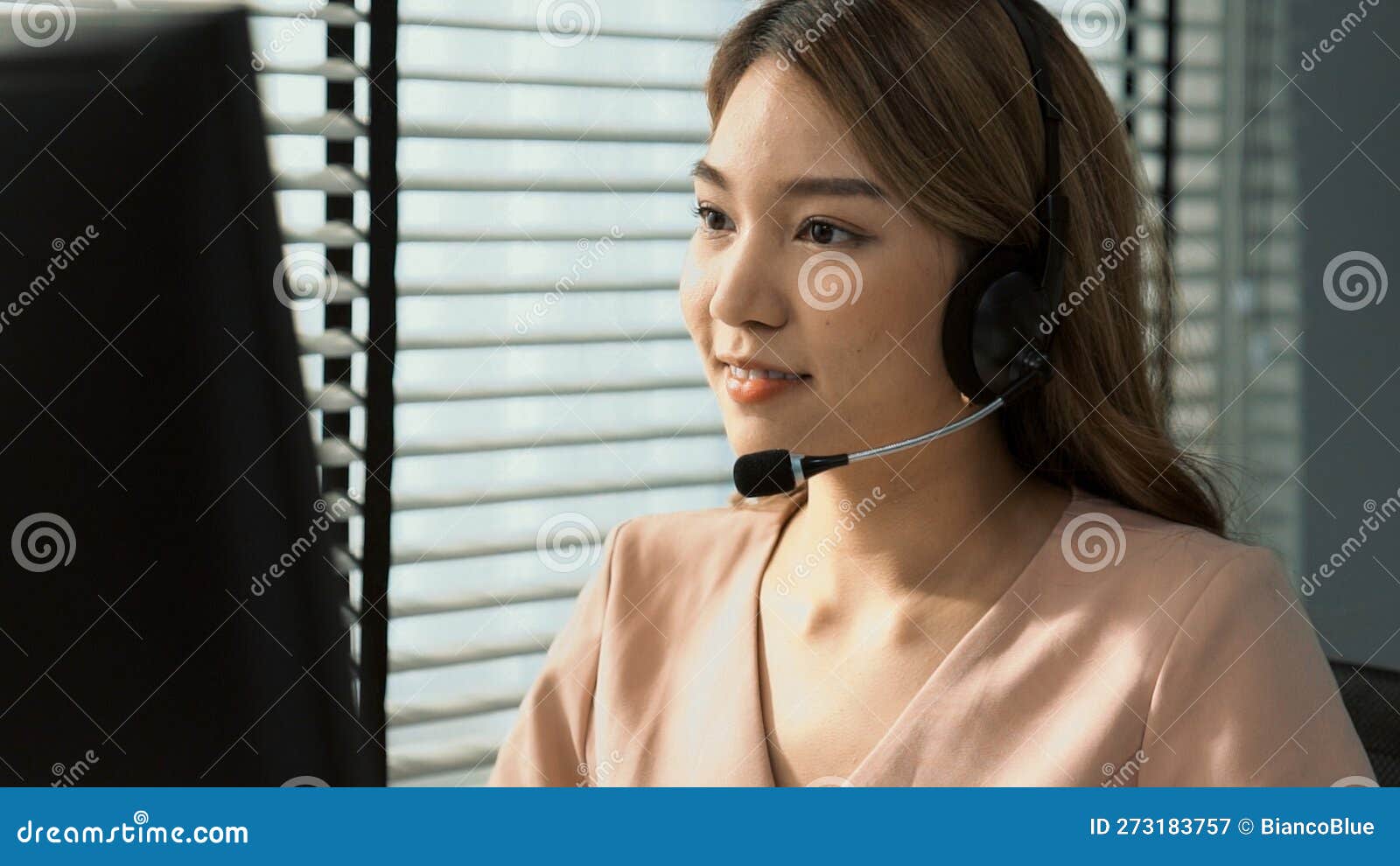 Competent Female Operator Working on Computer and while Talking with ...