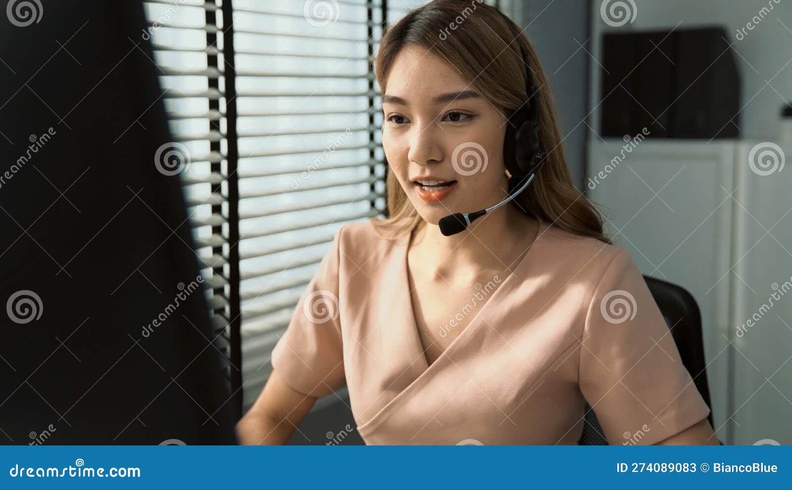 Competent Female Operator Working on Computer and while Talking with ...