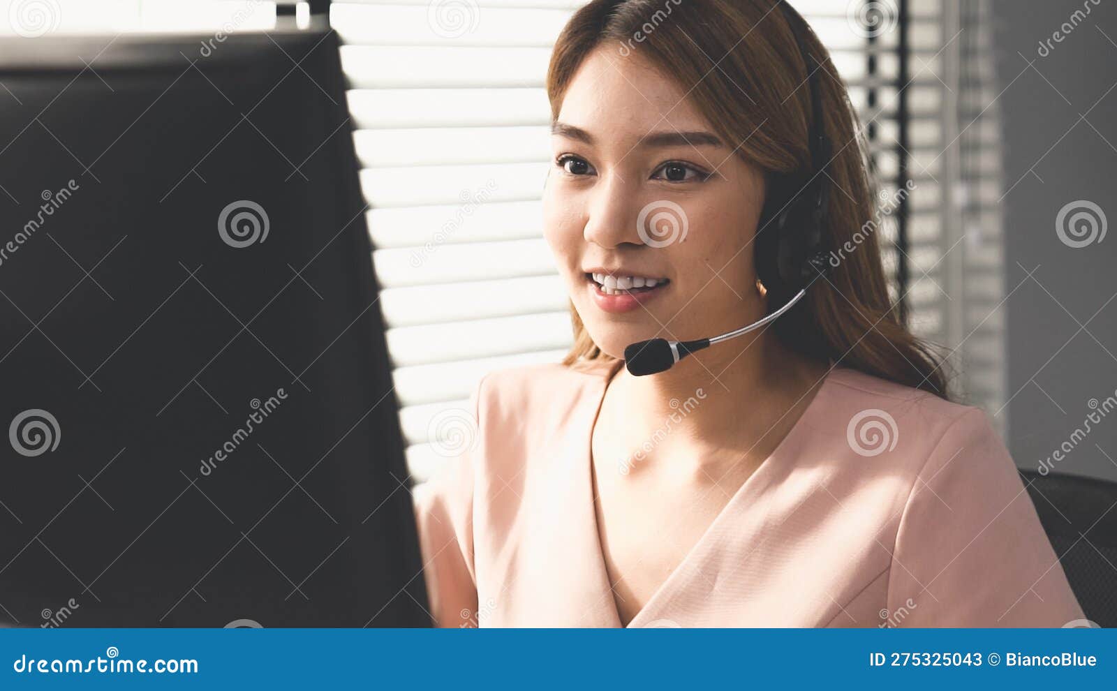 Competent Female Operator Working on Computer and while Talking with ...