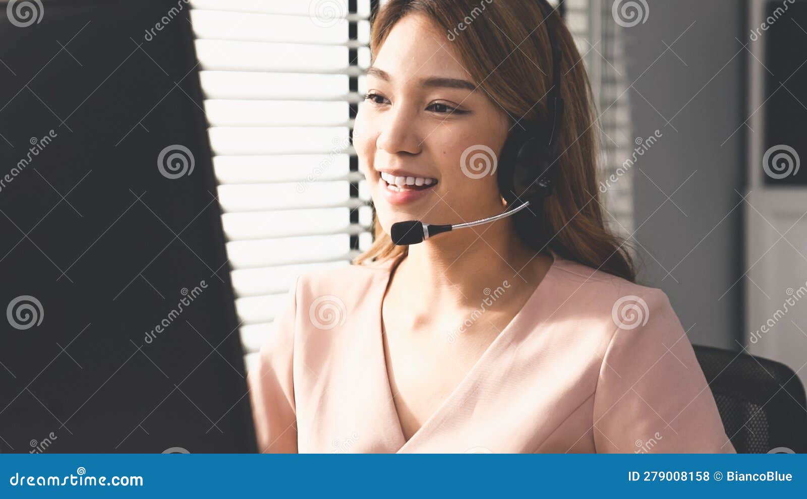 Competent Female Operator Working on Computer and while Talking with ...