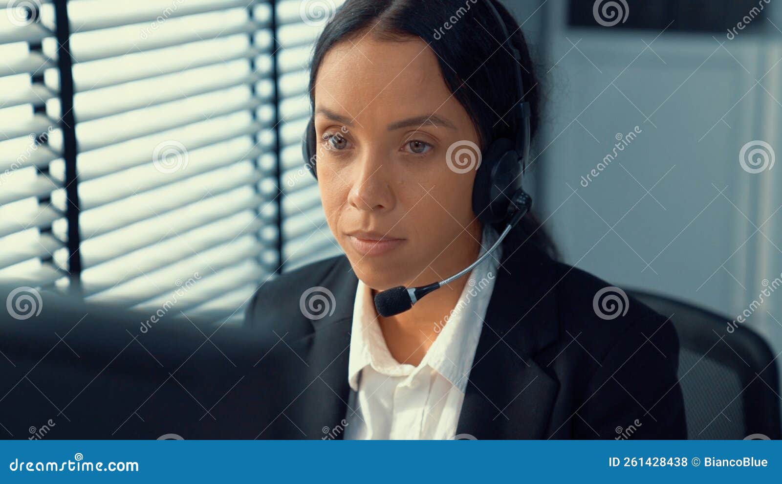 Competent Female Operator Working on Computer and while Talking with ...