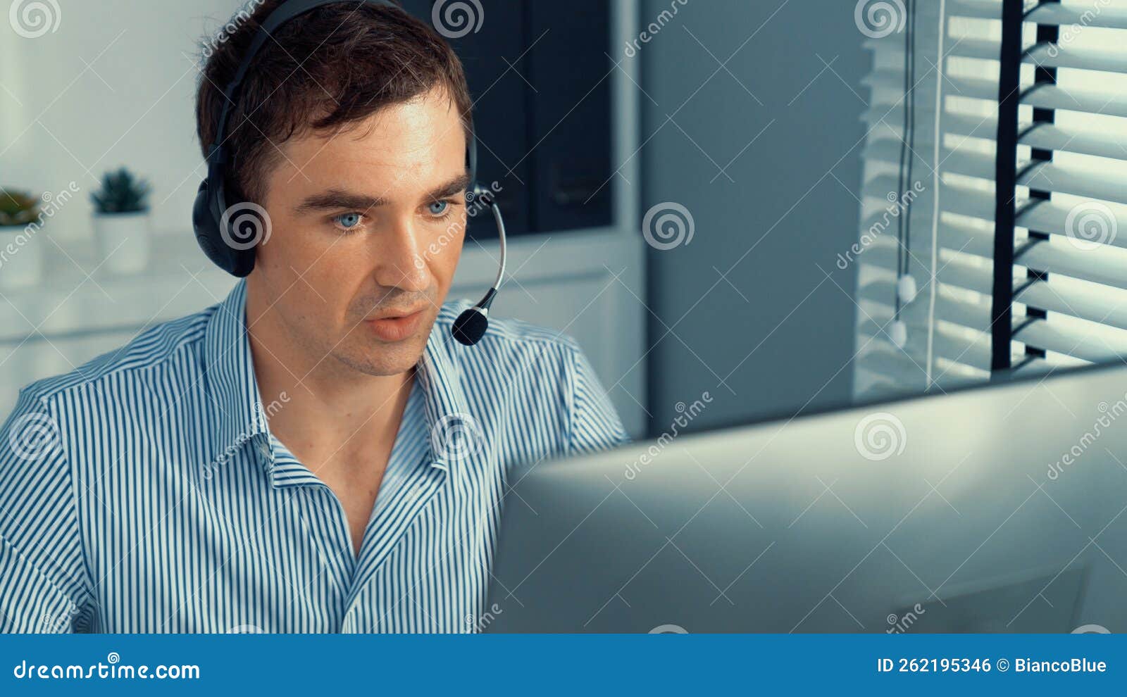 Competent Male Operator Working with Customers in the Office. Stock ...