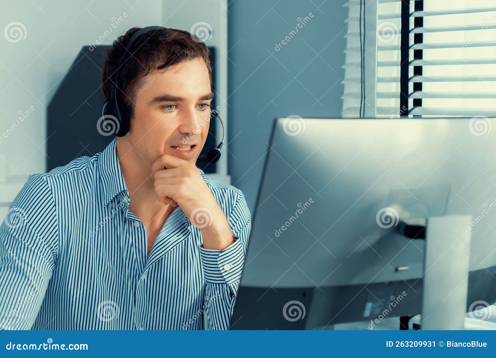 Competent Male Operator Working with Customers in the Office. Stock ...