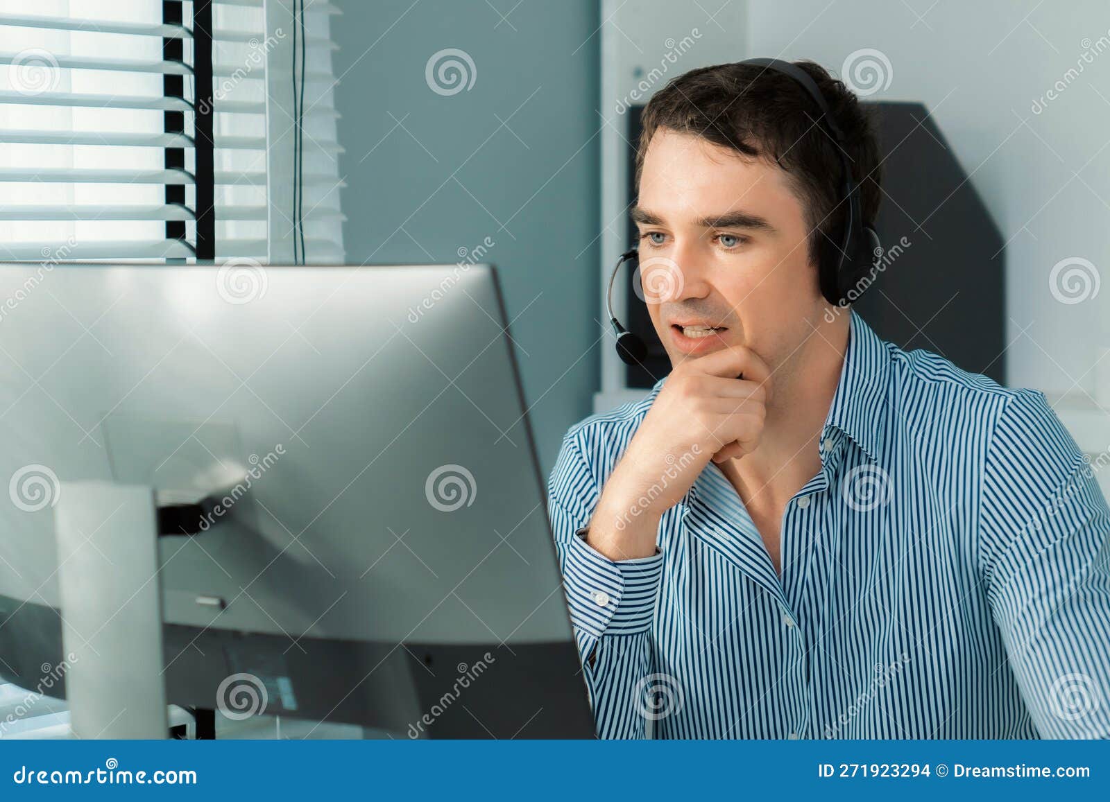 Competent Male Operator Working with Customers in the Office. Stock ...