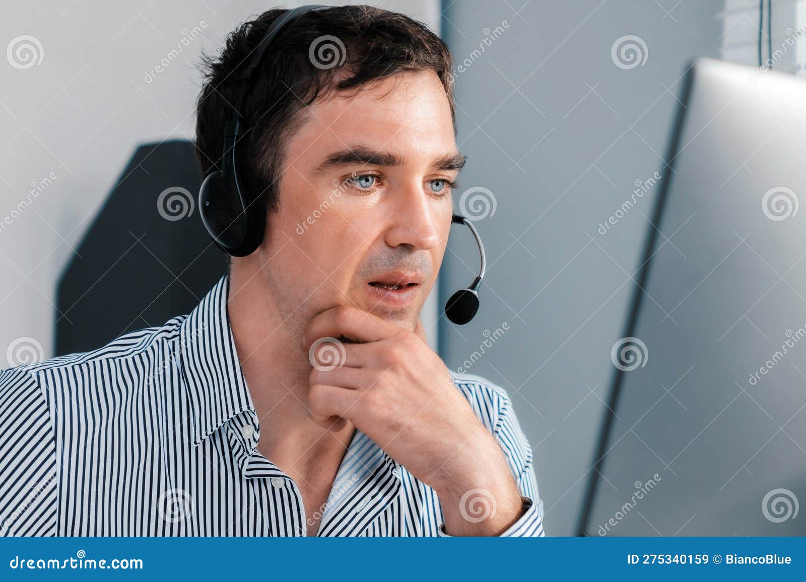 Competent Male Operator Working with Customers in the Office. Stock ...