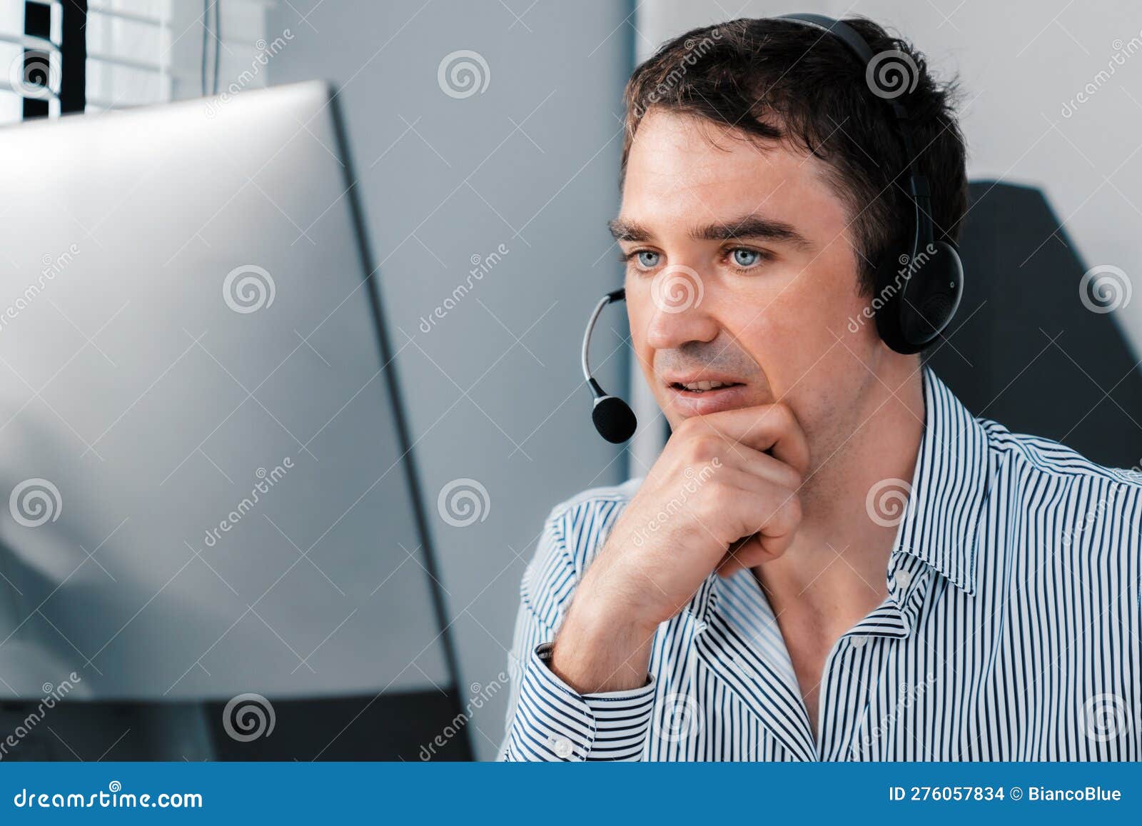 Competent Male Operator Working with Customers in the Office. Stock ...