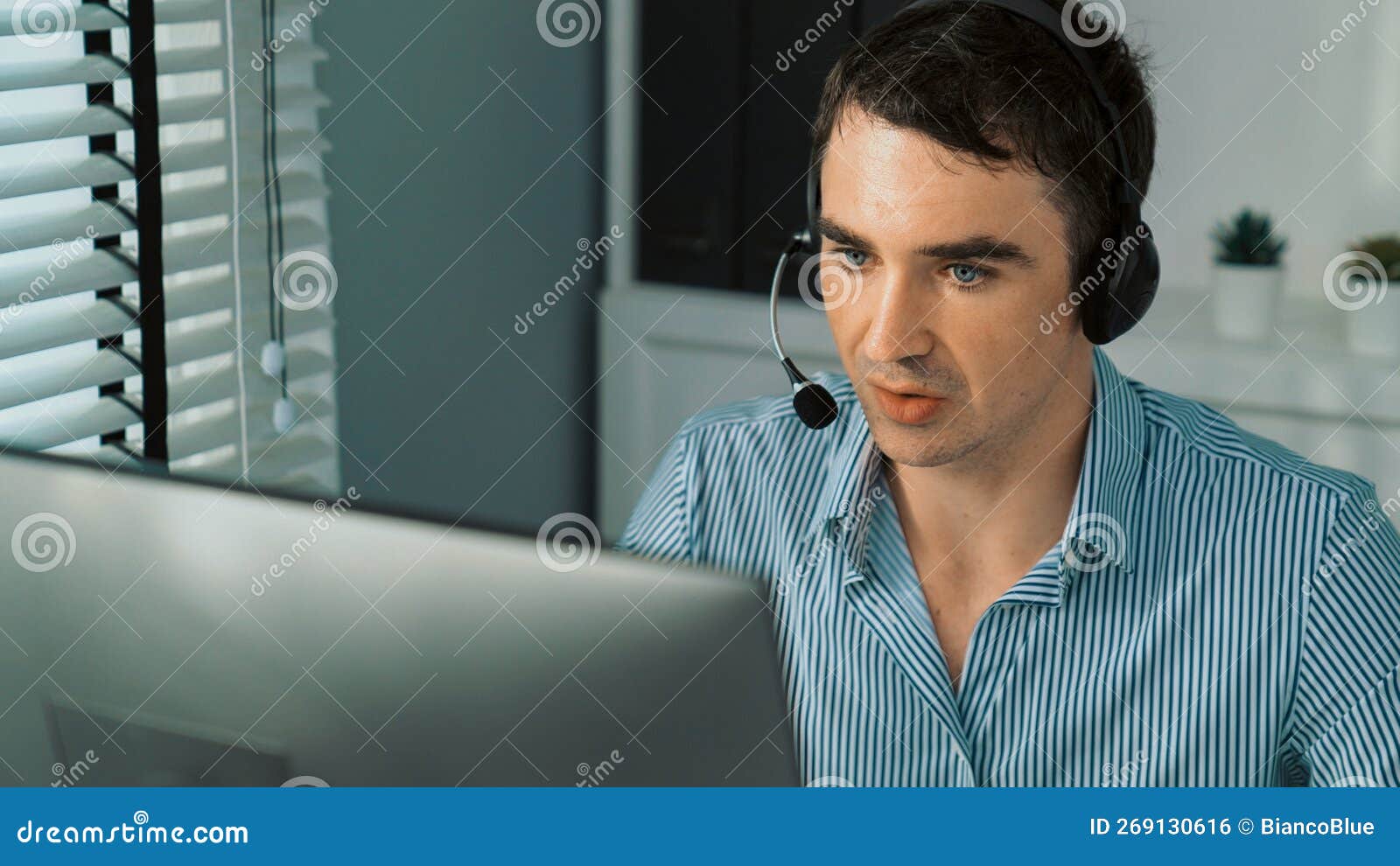 Competent Male Operator Working with Customers in the Office. Stock ...