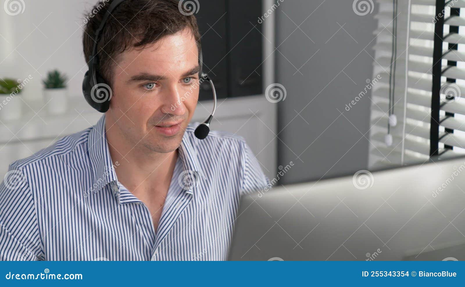 Competent Male Operator Working with Customers in the Office. Stock ...