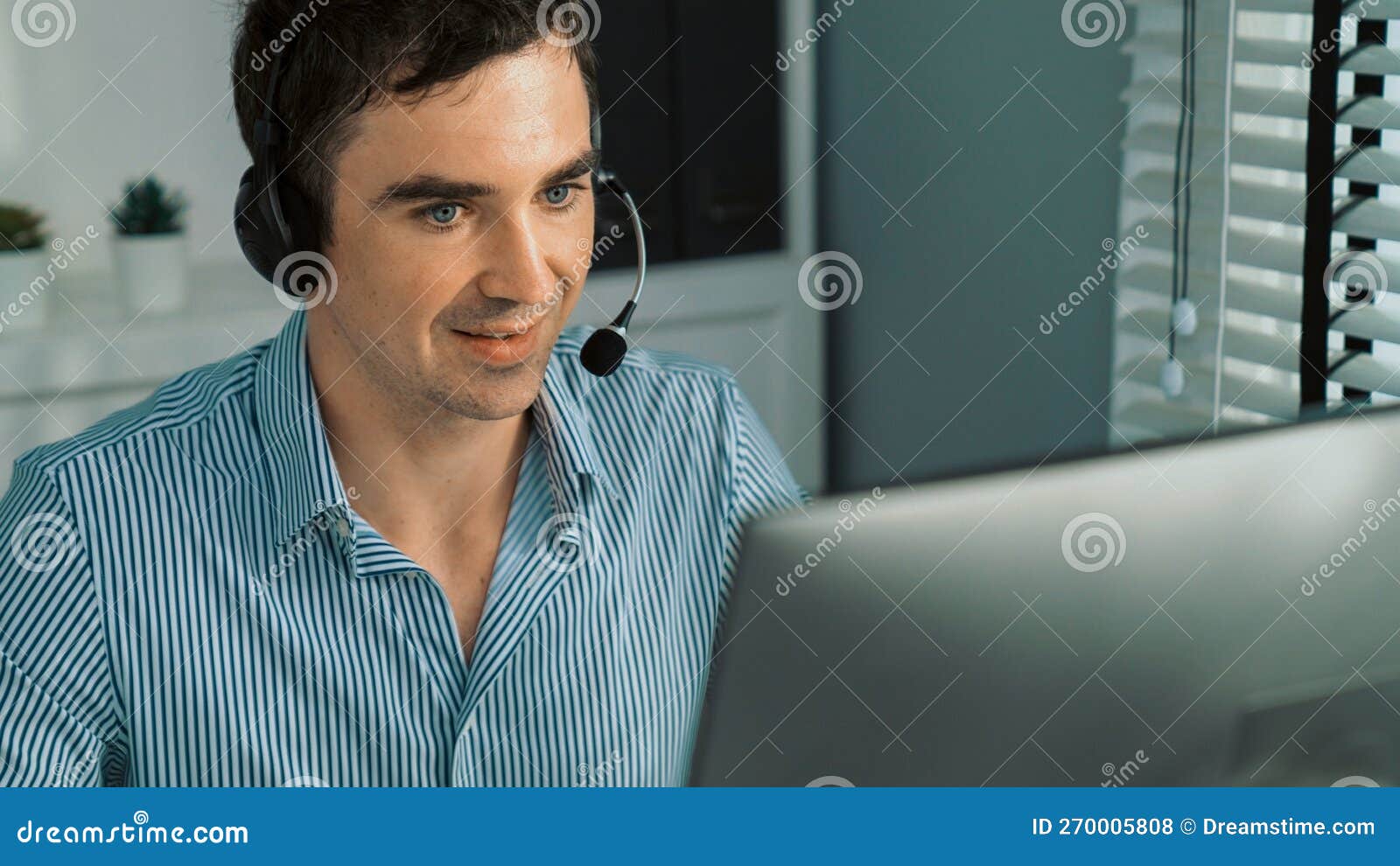 Competent Male Operator Working with Customers in the Office. Stock ...