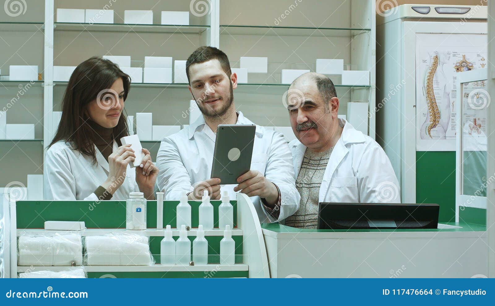 Competent Pharmacy Team with Pharmacist and Pharmacy Technicians Having ...
