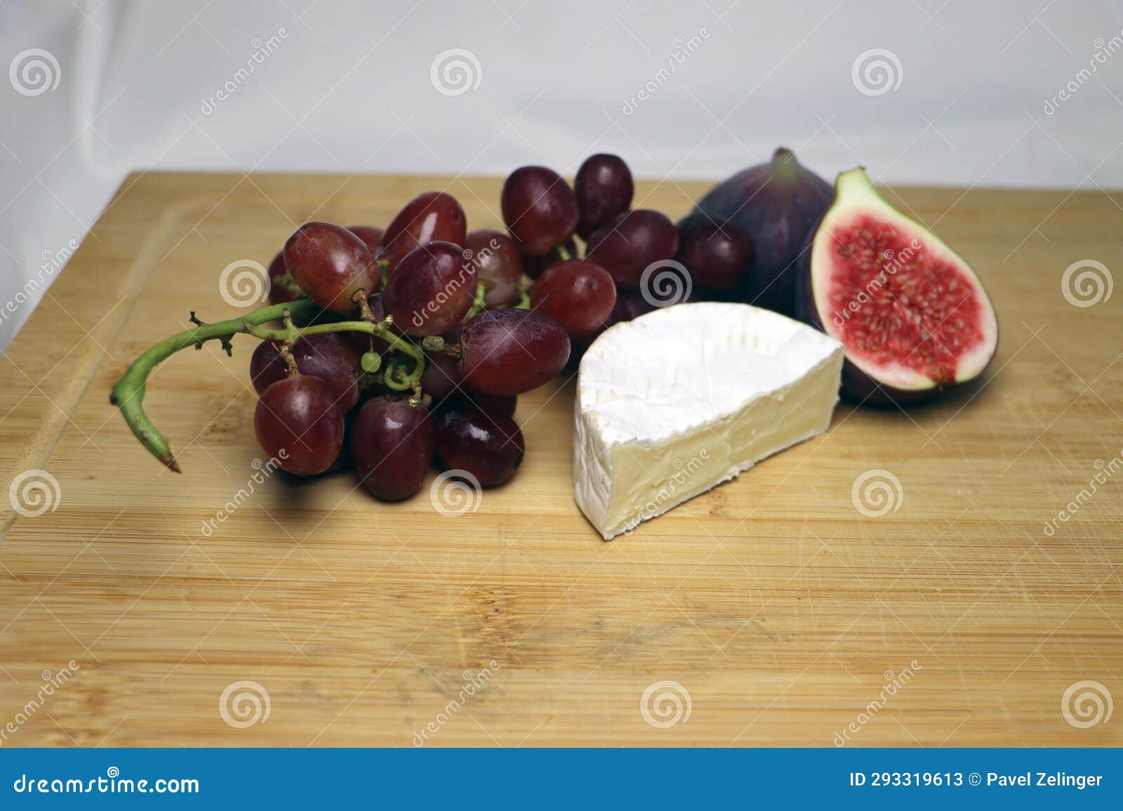 Grape, Fig, Cheese and Bun on Kitchen Breadboard Stock Image - Image of ...
