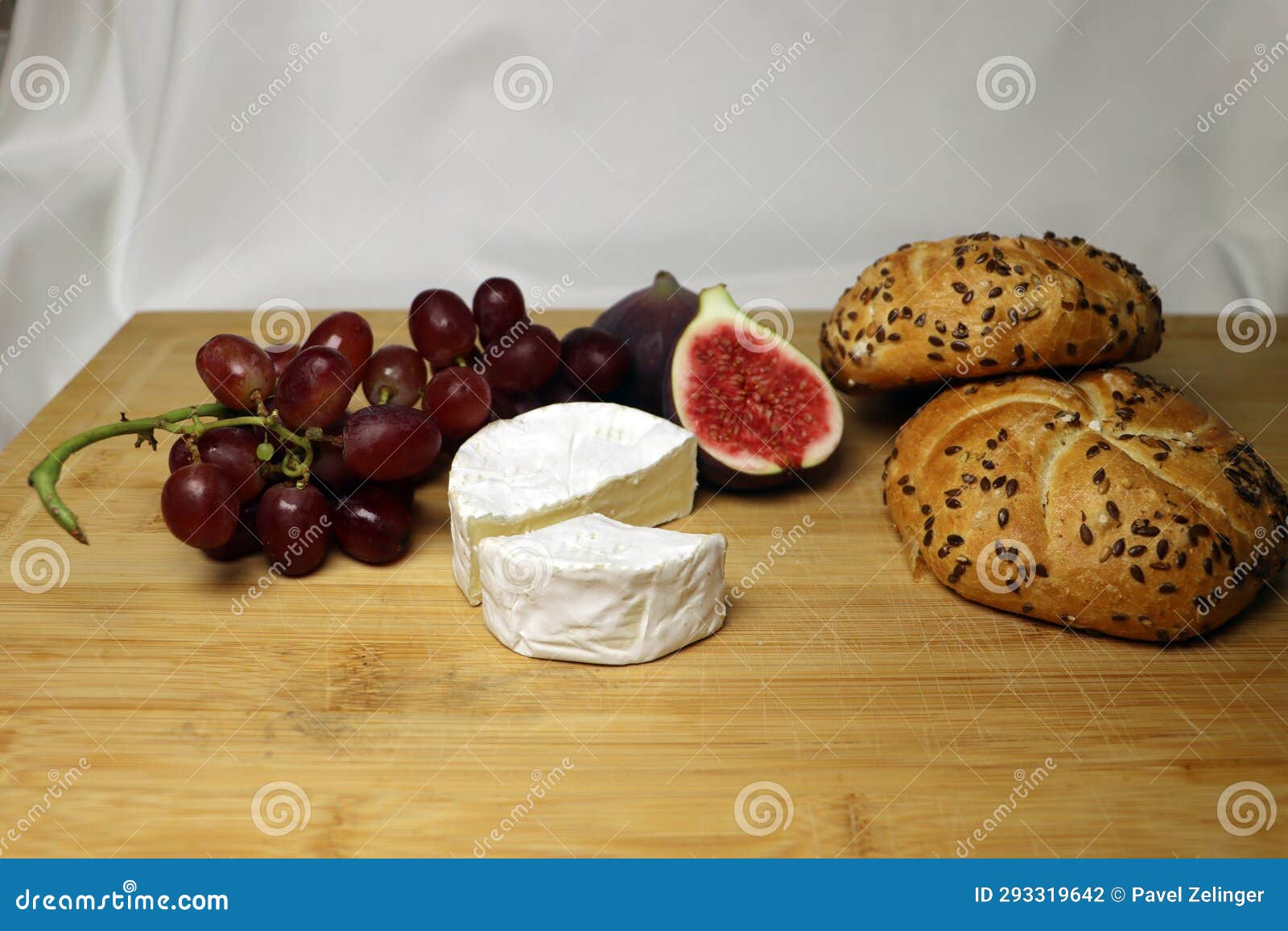 Grape, Fig, Cheese and Bun on Kitchen Breadboard Stock Photo - Image of ...
