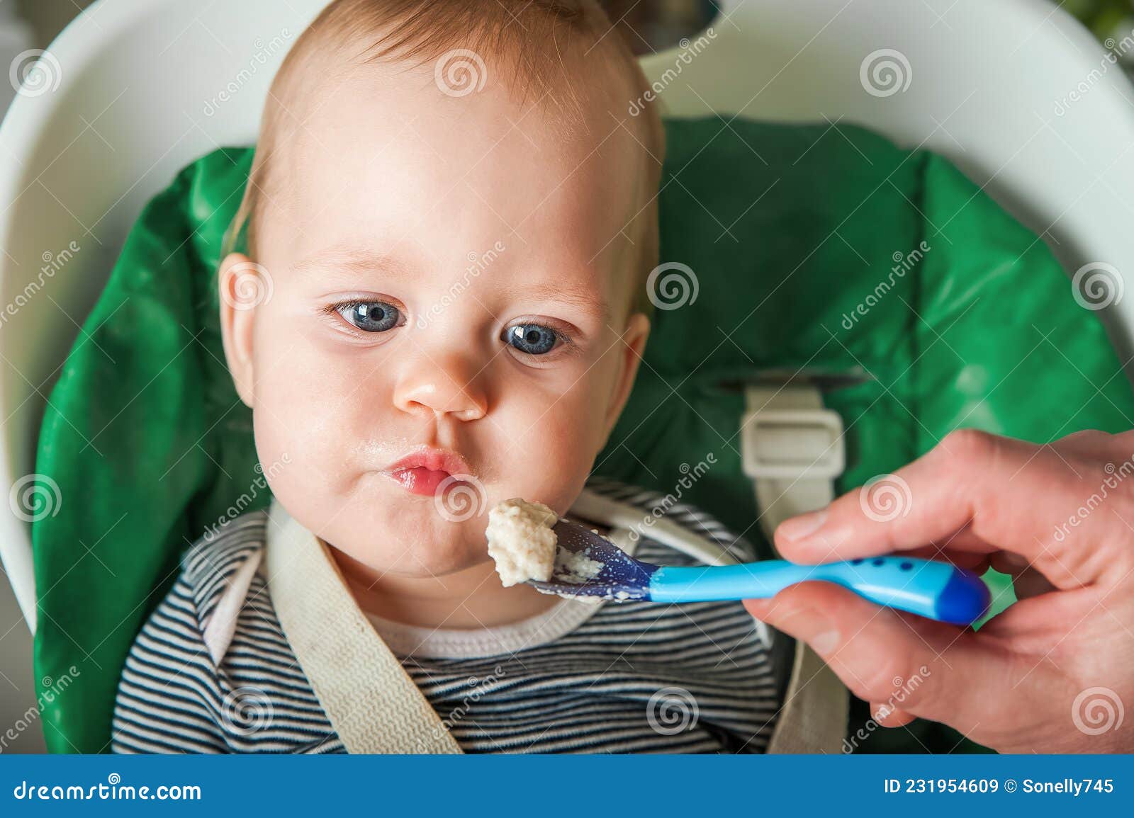Complementary Feeding of Child, Baby Food. the Infant is Spoon-fed ...