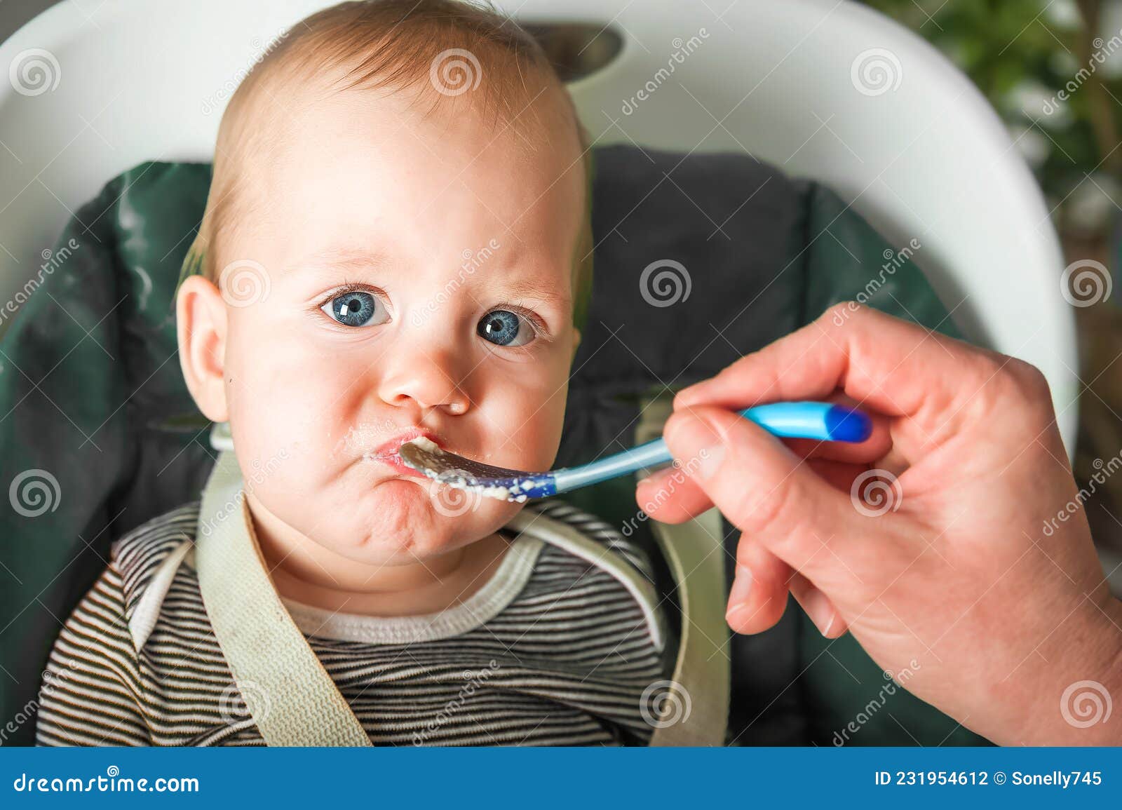 Complementary Feeding of Child, Baby Food. the Infant is Spoon-fed ...