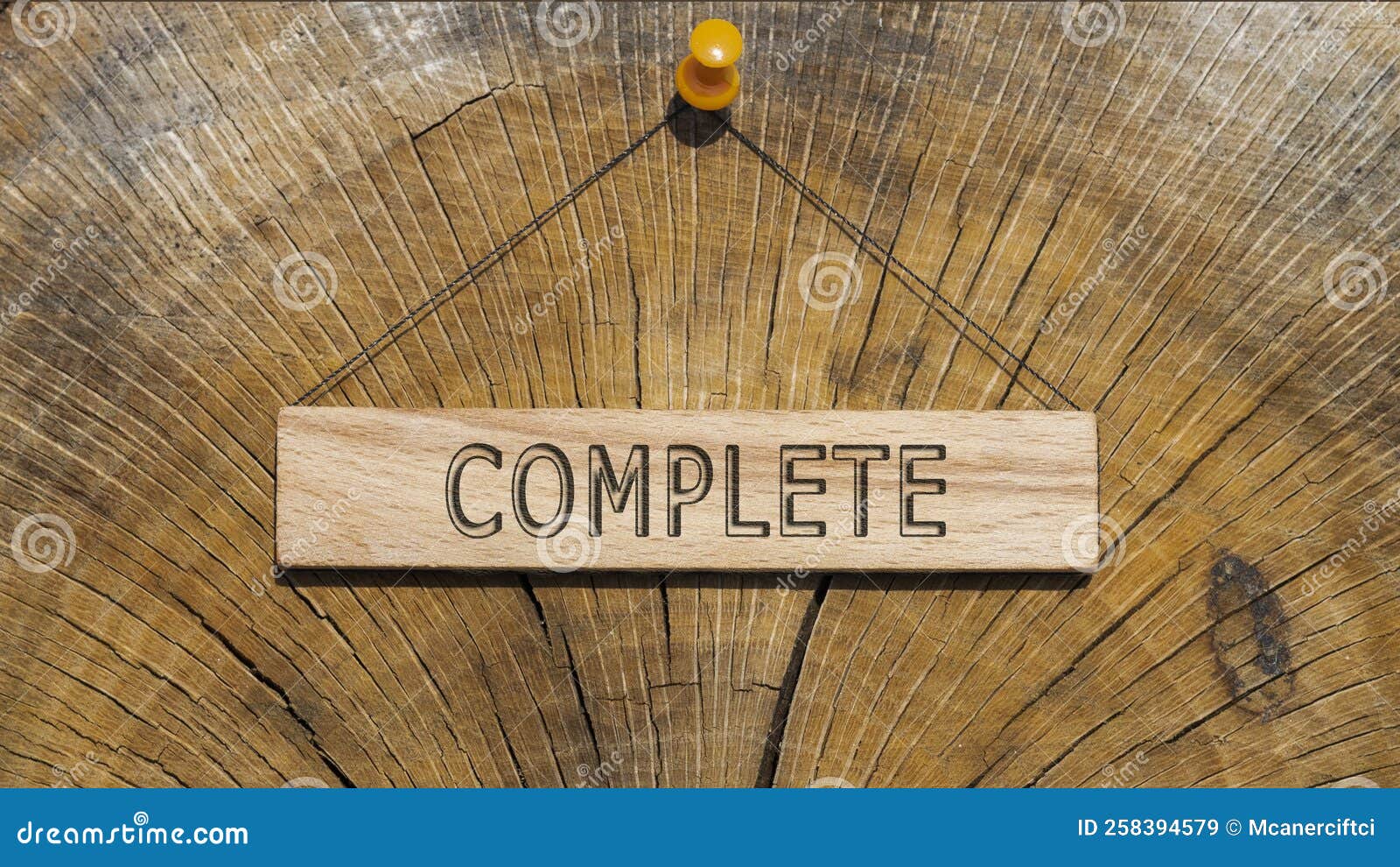 Complete. Written on Wooden Hanging Frame. Background Wood Cut Log ...