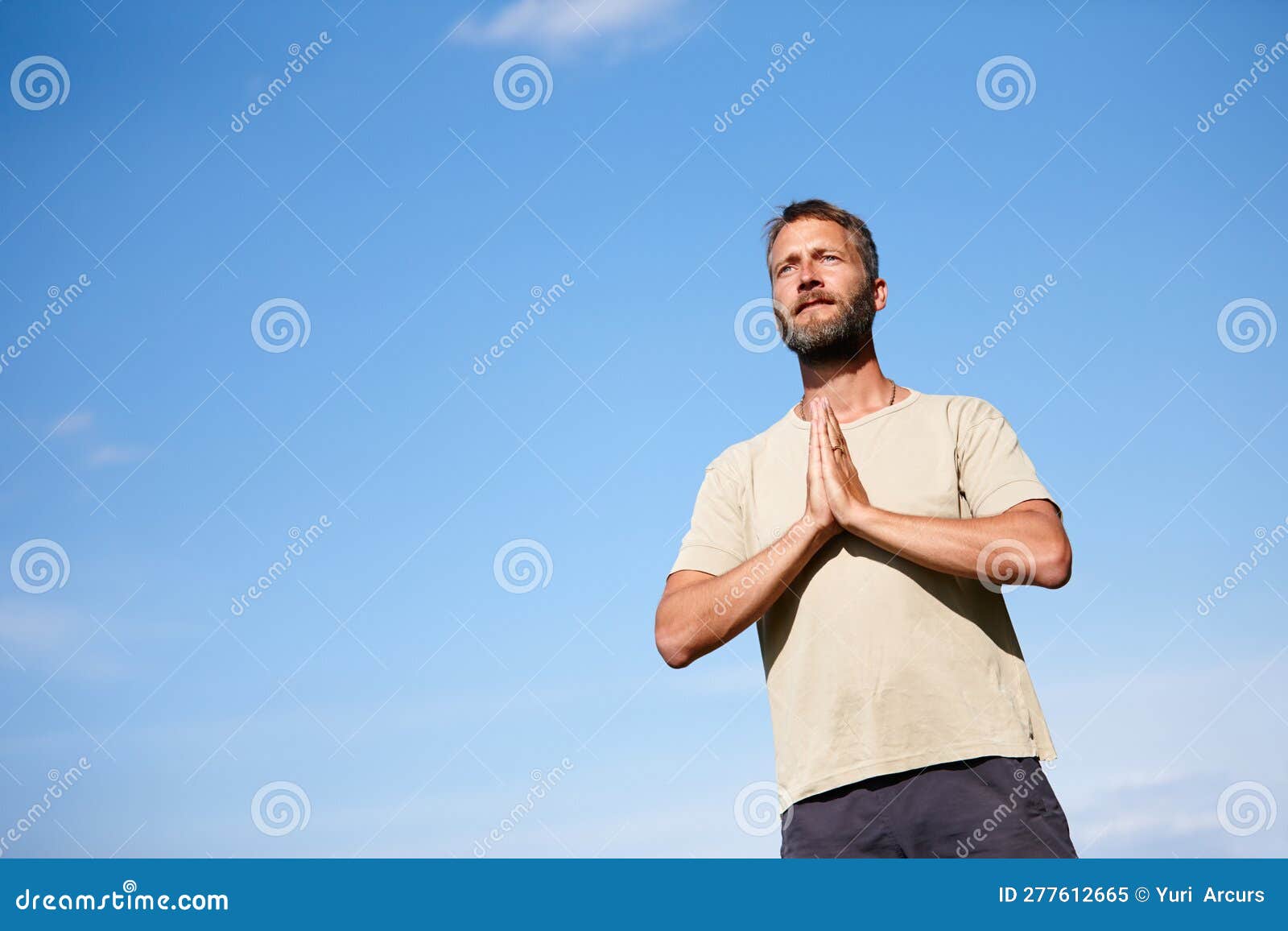 Completely Calm and Relaxed. a Handsome Mature Man Doing Yoga Outdoors ...