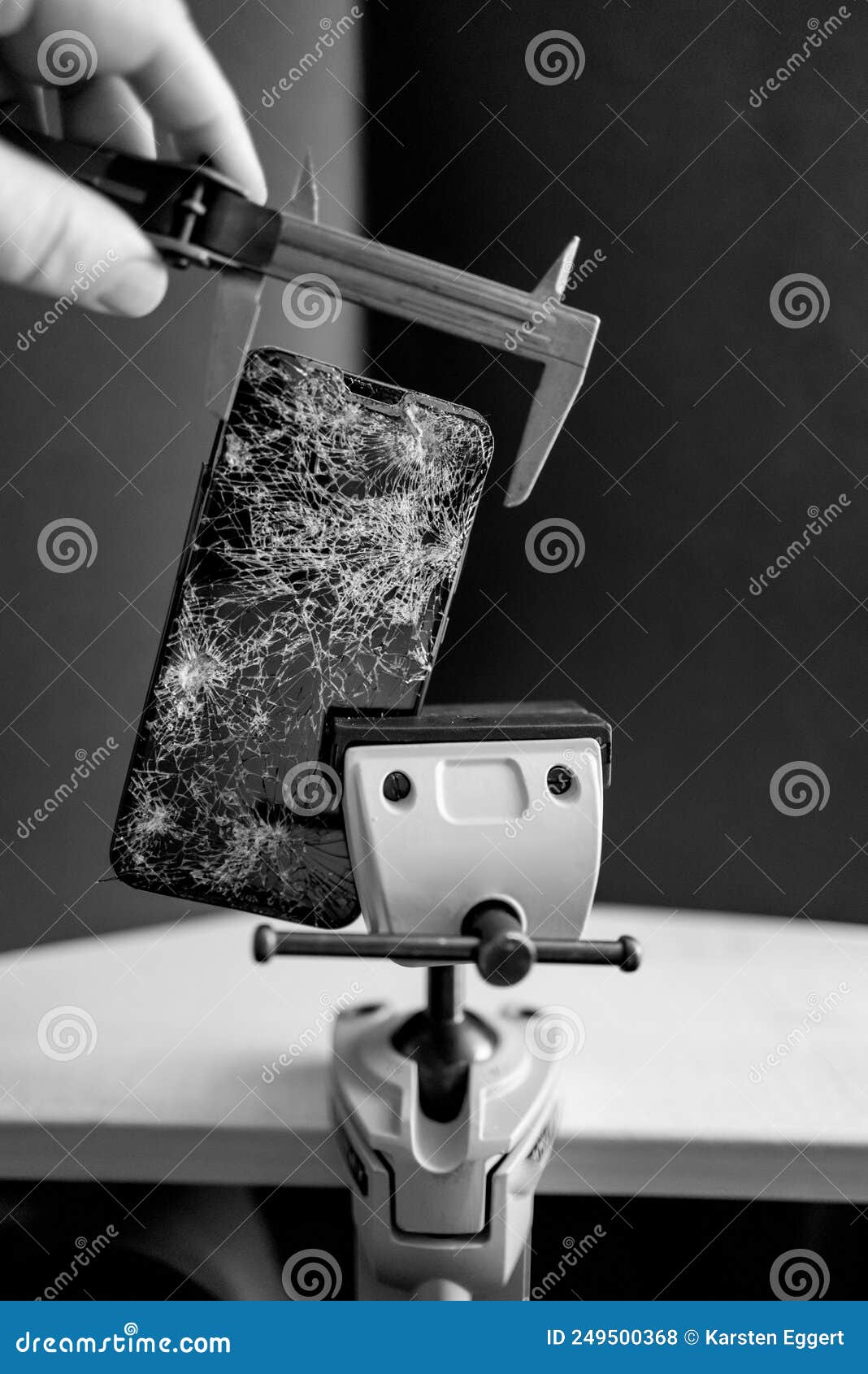 Completely Destroyed Cell Phone is Clamped in a Vice and Measured with ...