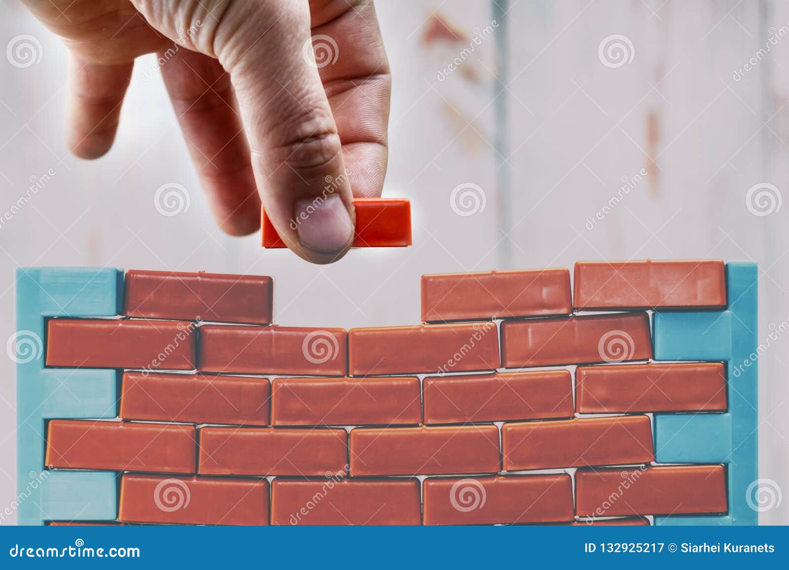 . Completion of the Brickwork. Close-up. Puts a Brick. There is Toning ...