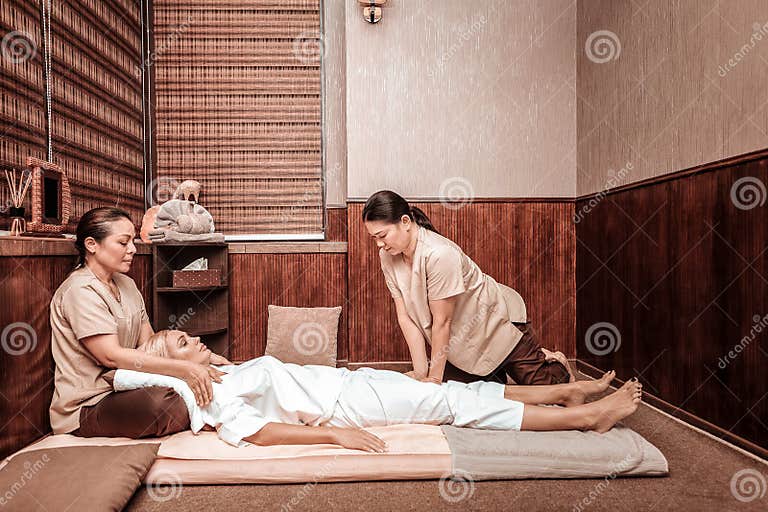 Woman Getting Her Shoulders And Leg Massage Stock Image Image Of