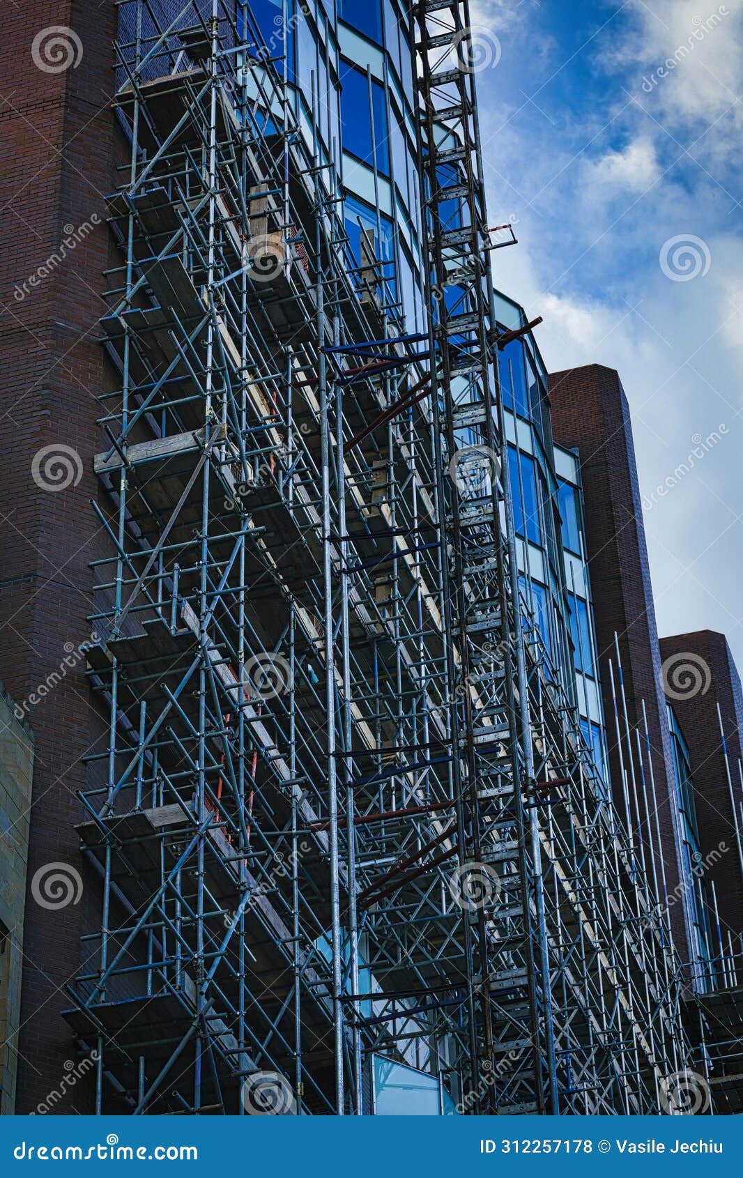 Complex Scaffolding Structure on the Side of a Modern Building with ...