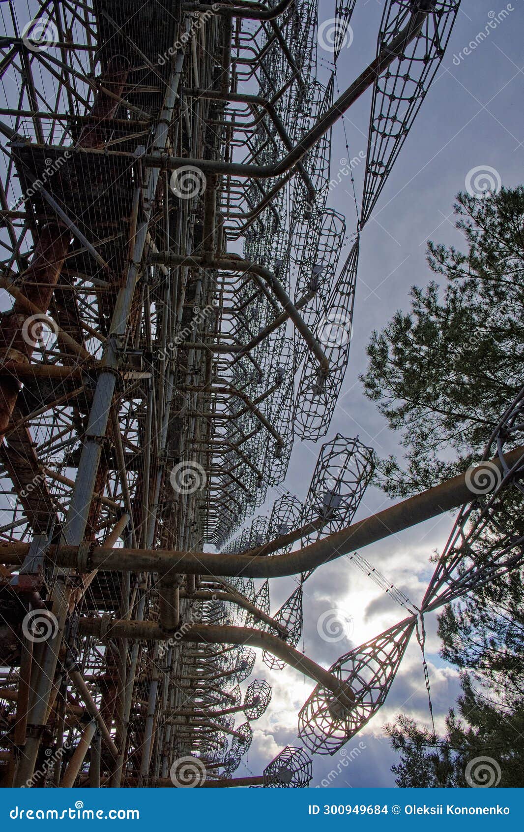 A Complex Structure of Rusted Metal Beams and Wire Grids Against a ...