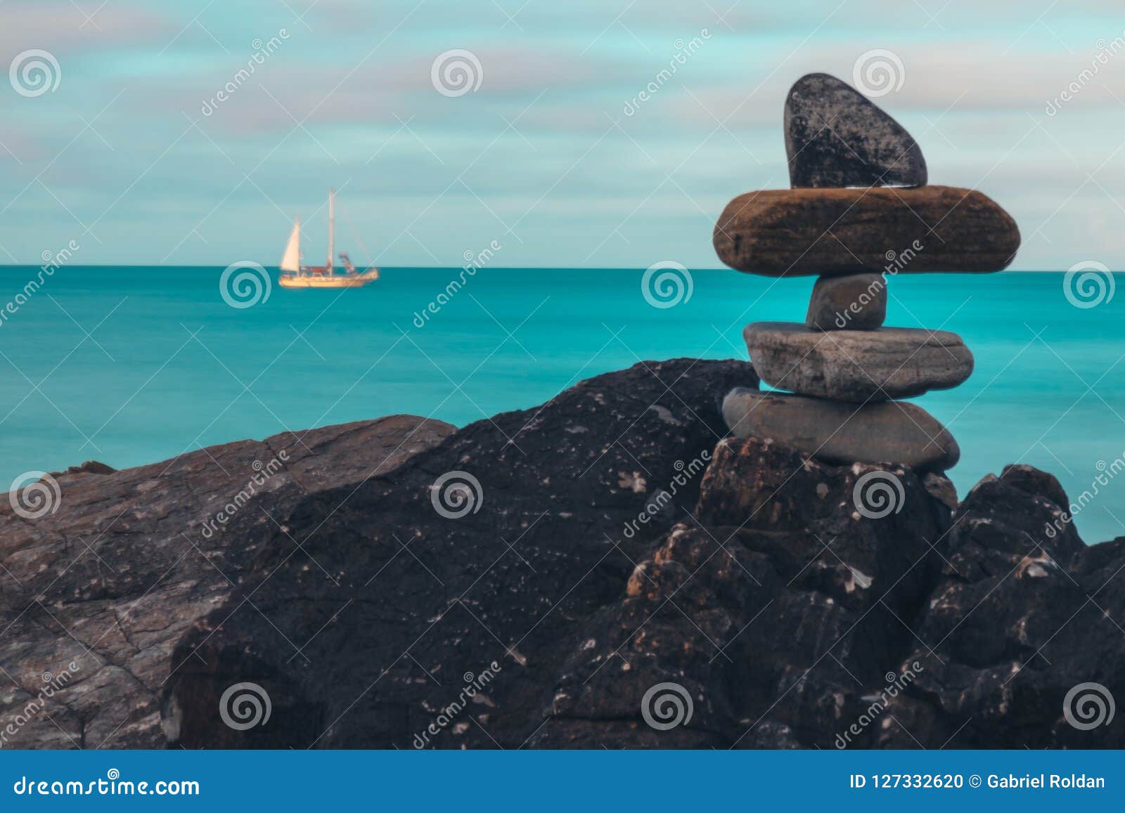 Composed Rocks on Shore with Sailing Ship Stock Photo - Image of ...