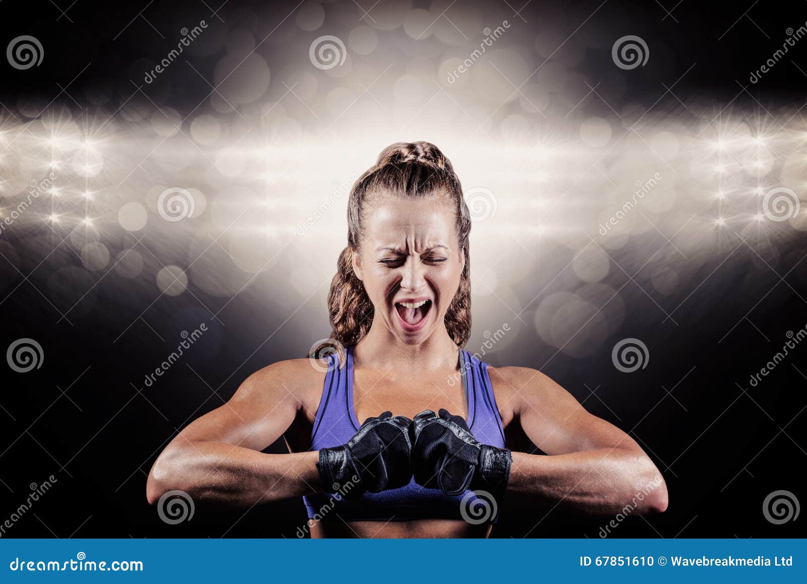 Composite Image of Aggressive Female Boxer Flexing Muscles Stock Photo ...