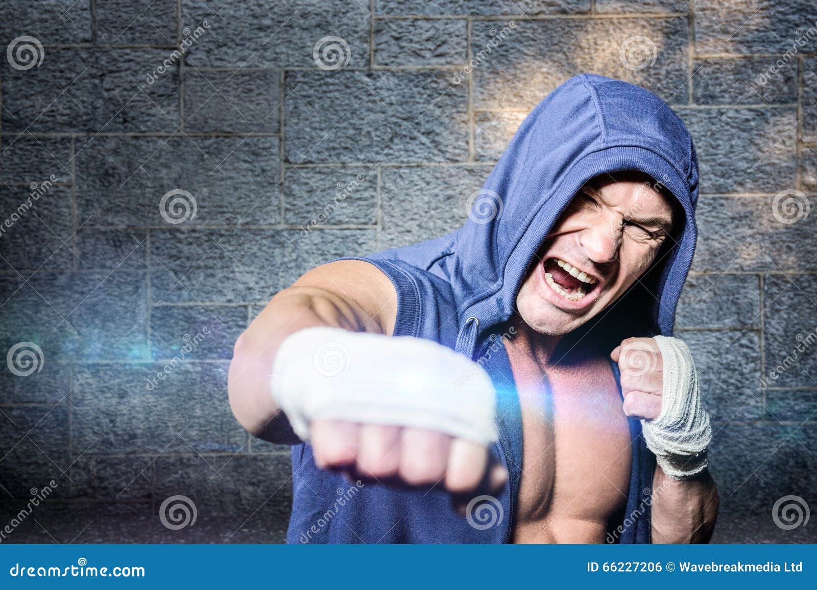 Composite Image of Aggressive Fighter Punching Against Black Background ...