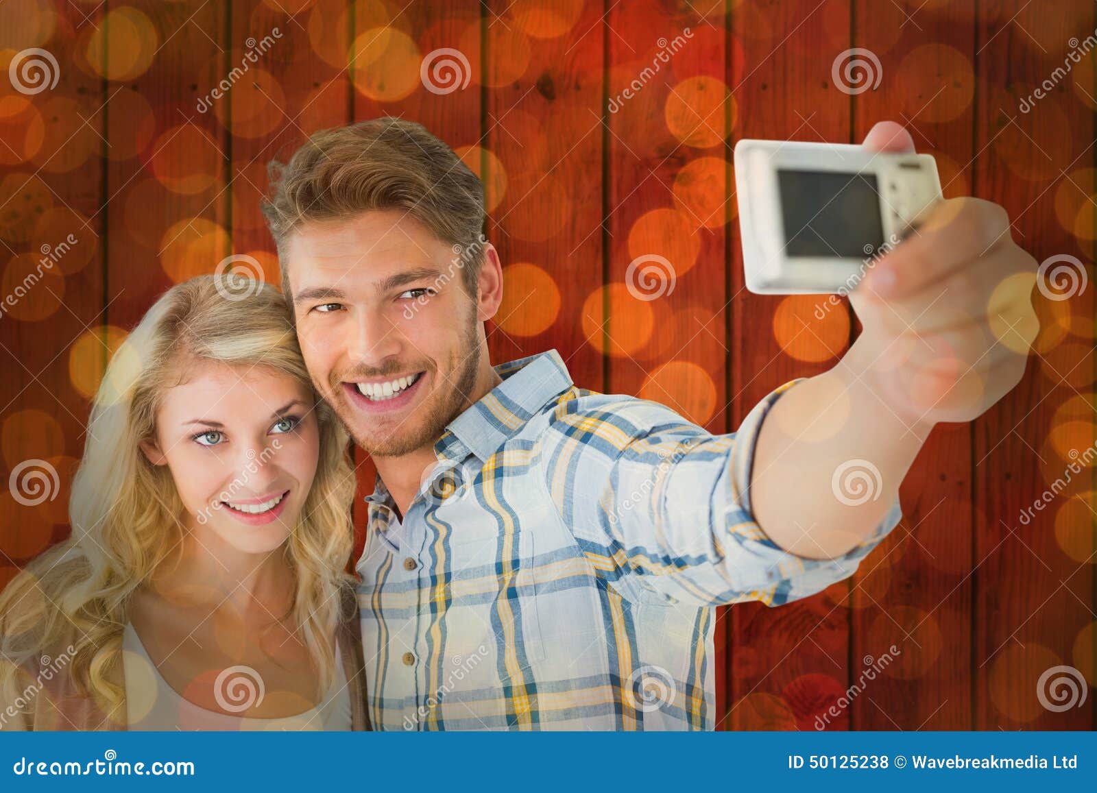 Composite Image Of Attractive Couple Taking A Selfie Together Stock