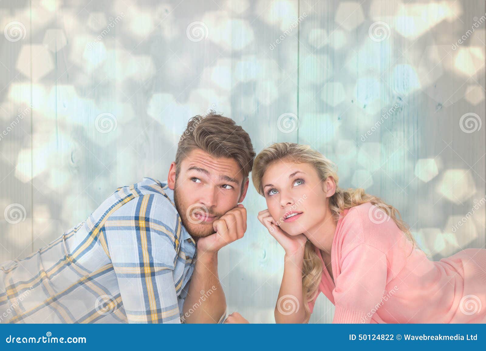 Composite Image of Attractive Young Couple Lying and Thinking Stock ...