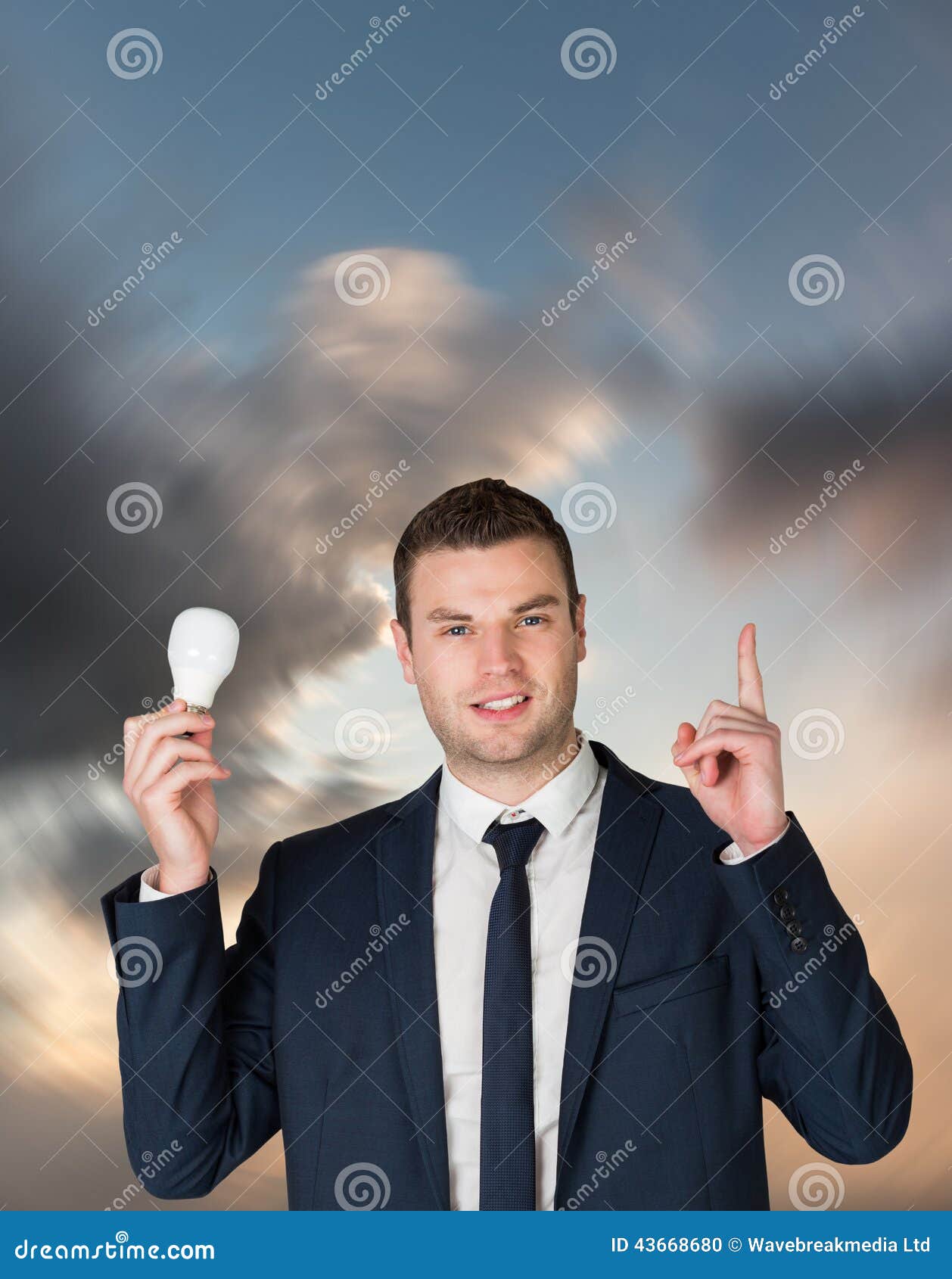 Composite Image of Businessman Holding Light Bulb and Pointing Stock ...