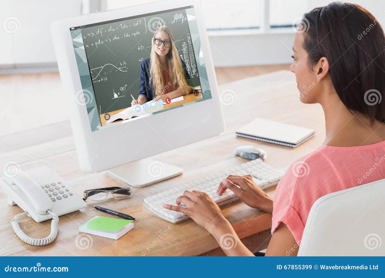 Composite Image of Businesswoman Using Computer at Desk in Creative ...