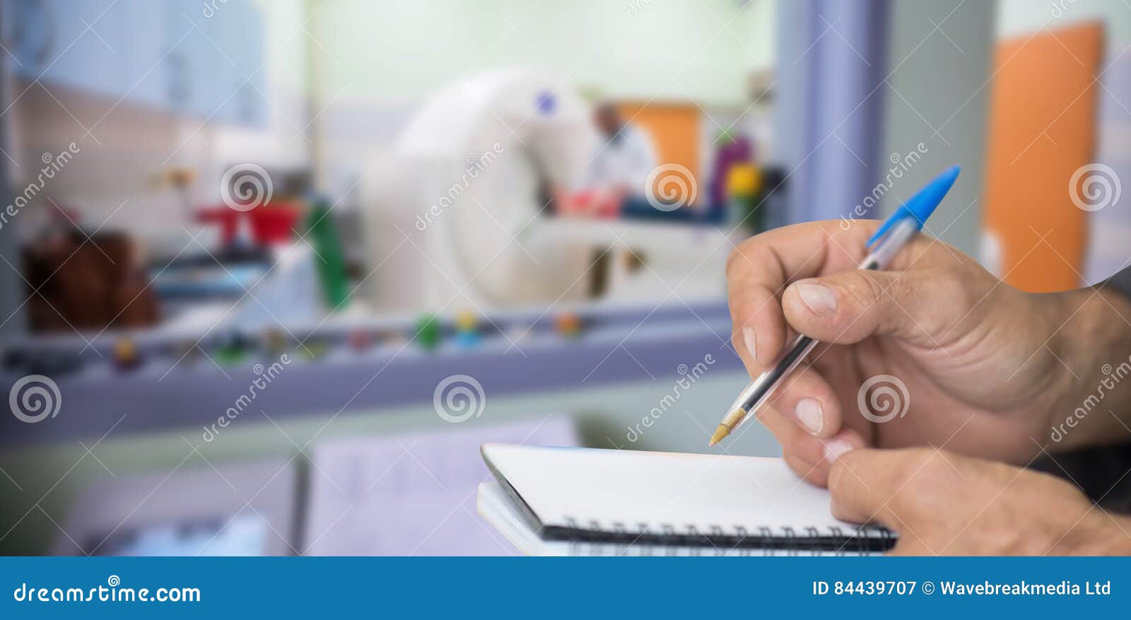 Composite Image of Close Up of Man Writing in Notepad Stock Image ...