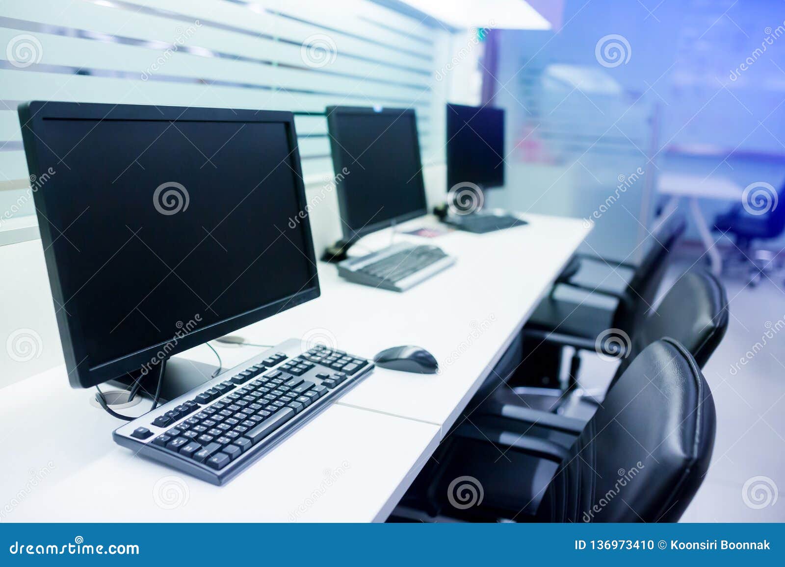 Composite Image Of Computer In Office Or Training Room Stock Photo ...