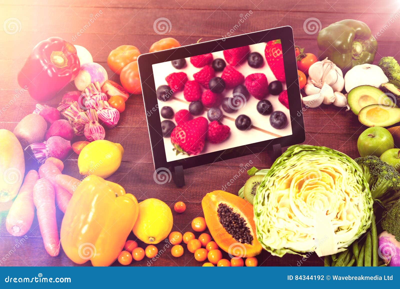 Composite Image of Digital Tablet Surrounded with Fresh Fruits and ...